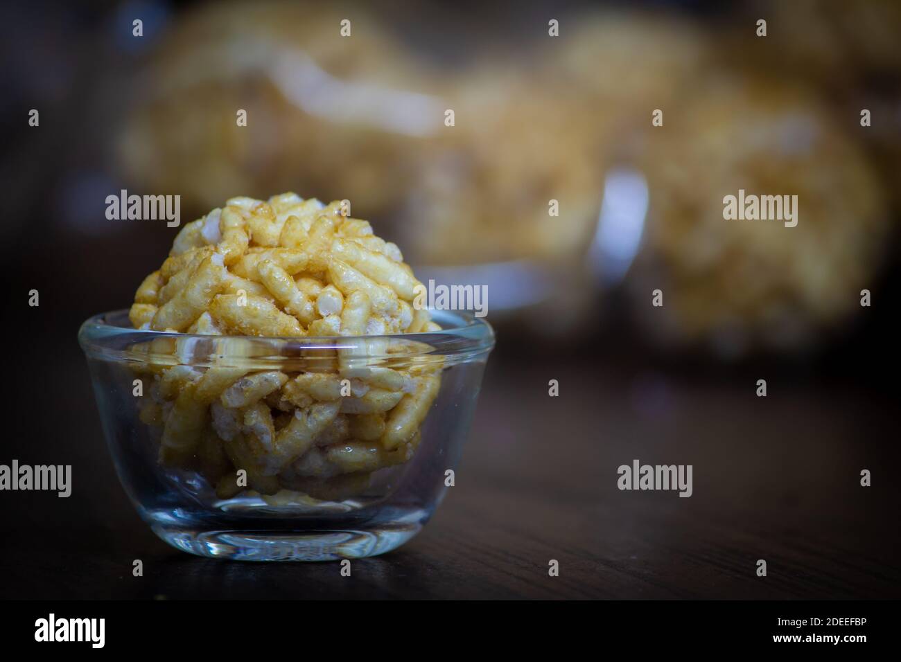 View of sweet puffed rice balls(also known as muri, porri) in a bowl ...