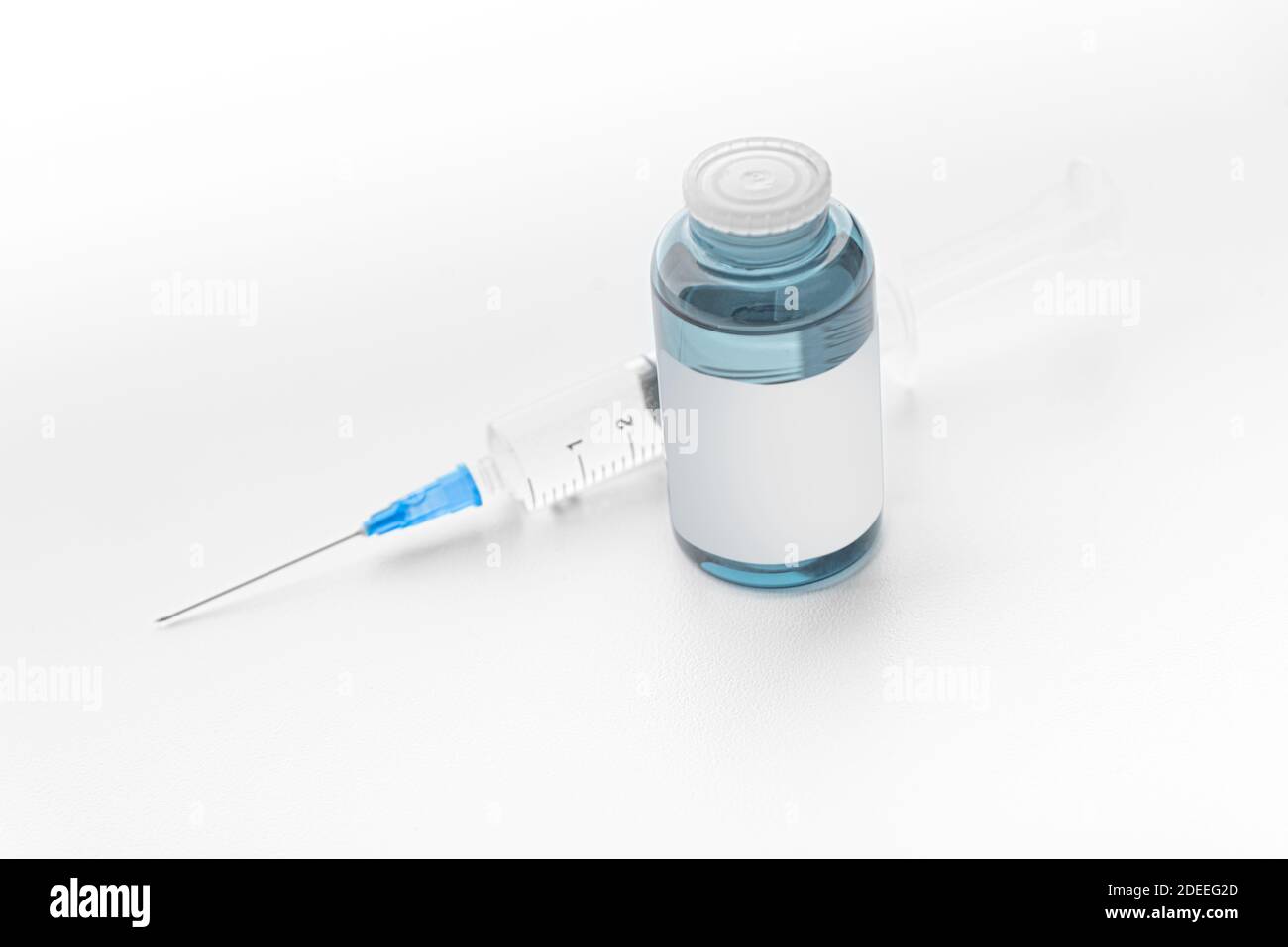 Syringe and injection in a bottle on a white background Stock Photo - Alamy