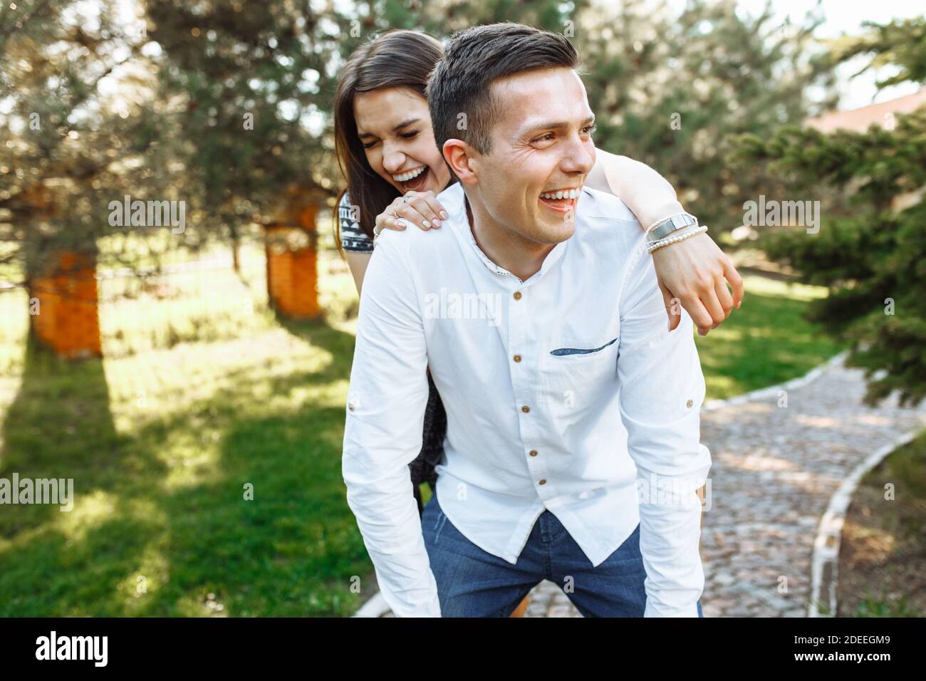 young, happy, loving couple, frolic and have fun in the Park, and enjoy ...