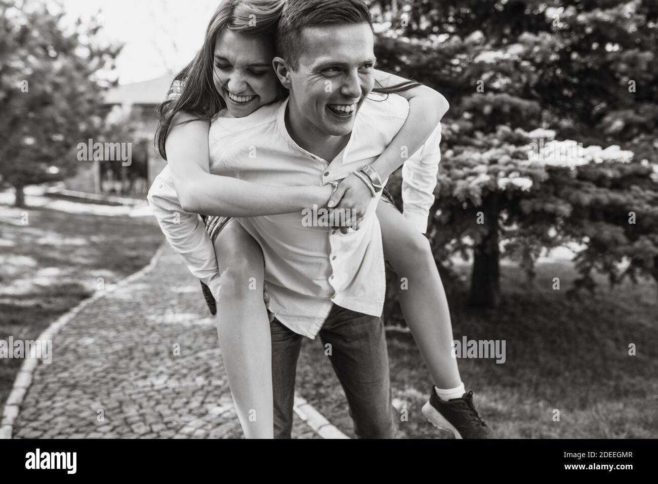 young, happy, loving couple, frolic and have fun in the Park, and enjoy ...