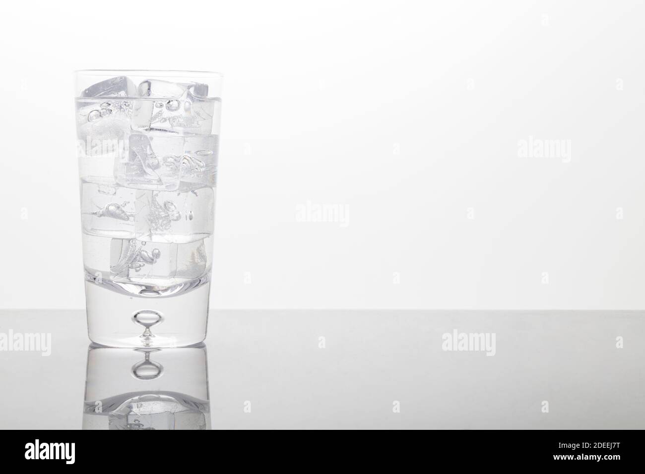 Ice cold glass of water with ice Stock Photo - Alamy