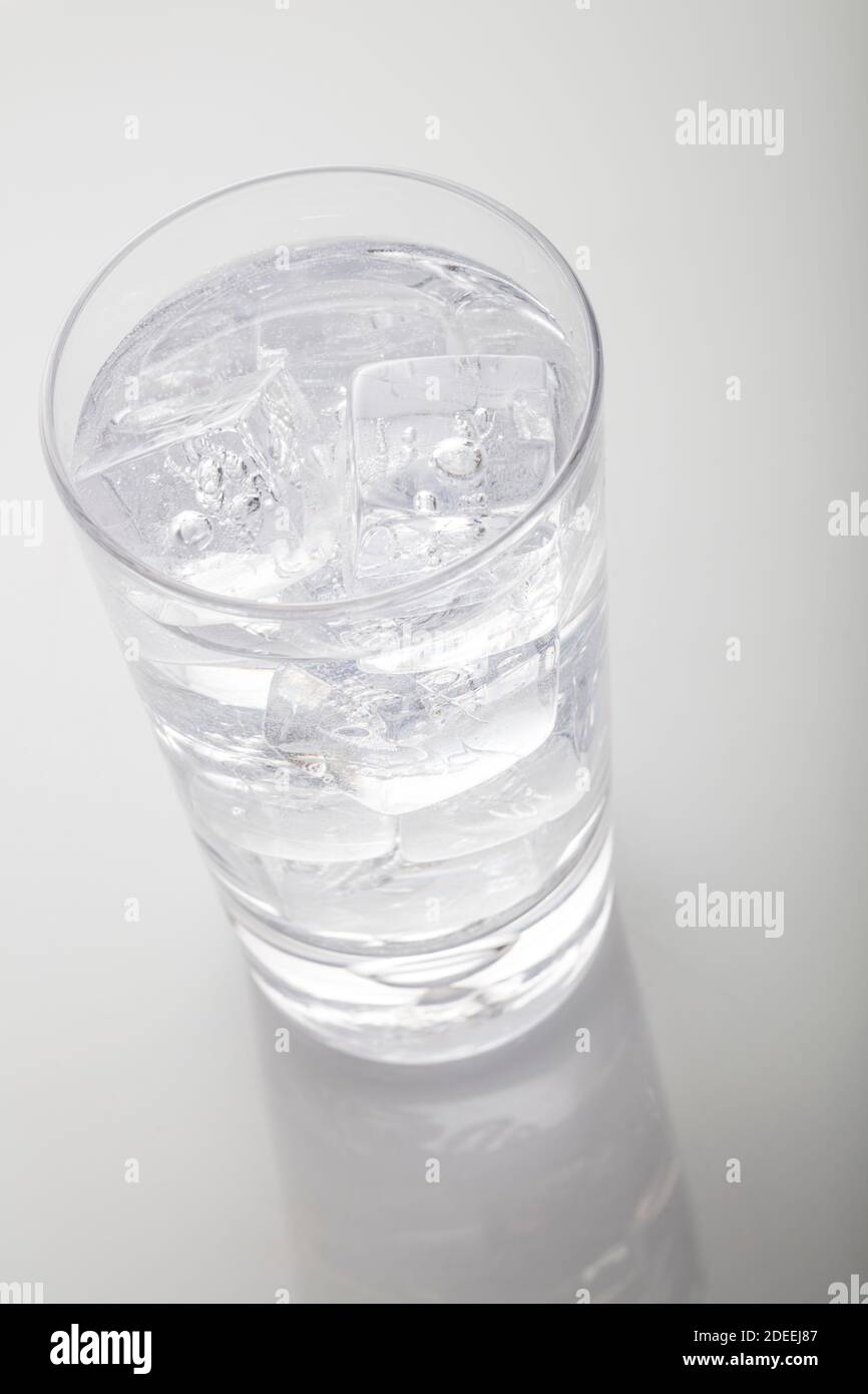 Ice cold glass of water with ice Stock Photo - Alamy