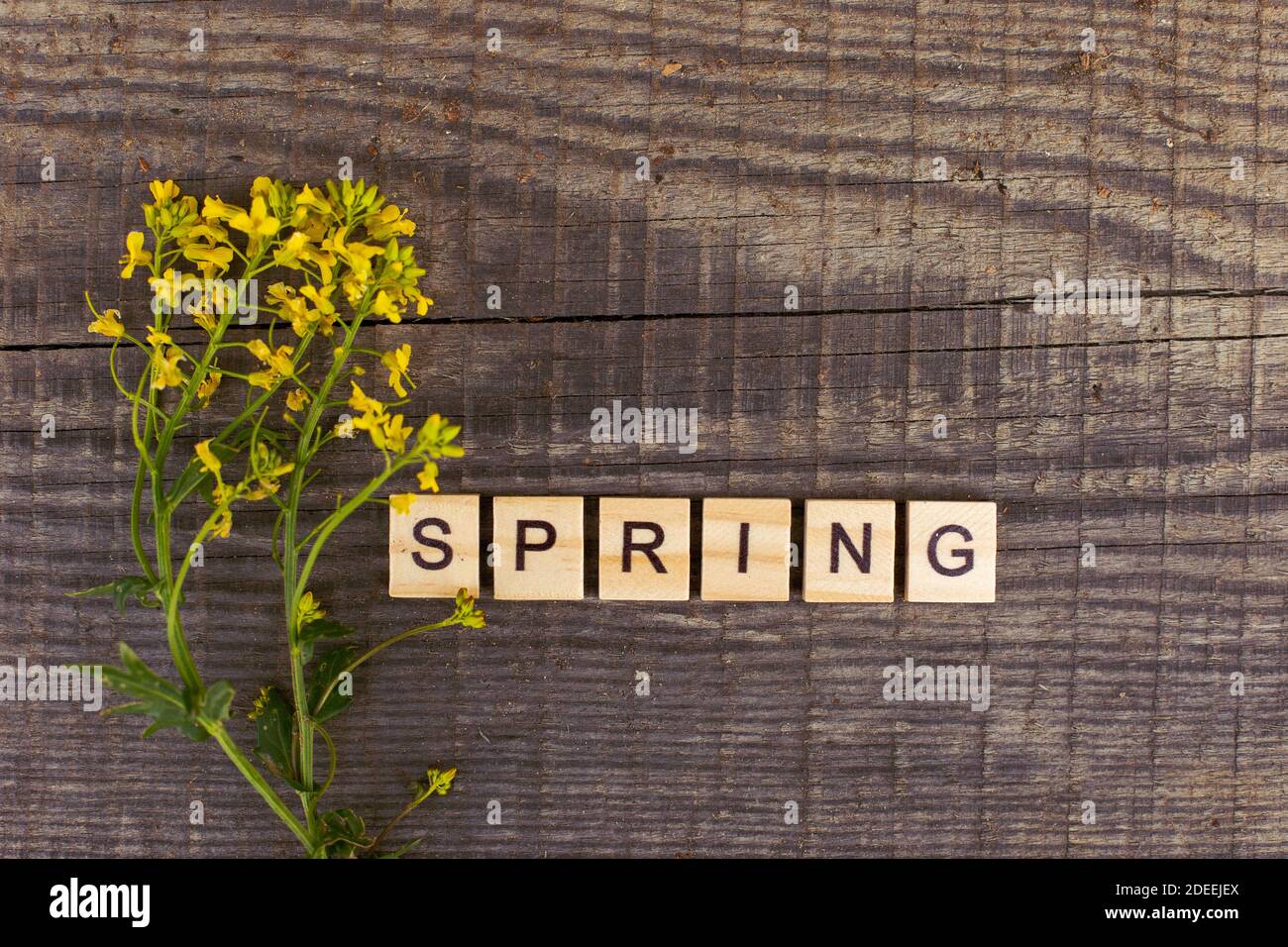 Block letters on wooden table hi-res stock photography and images - Alamy