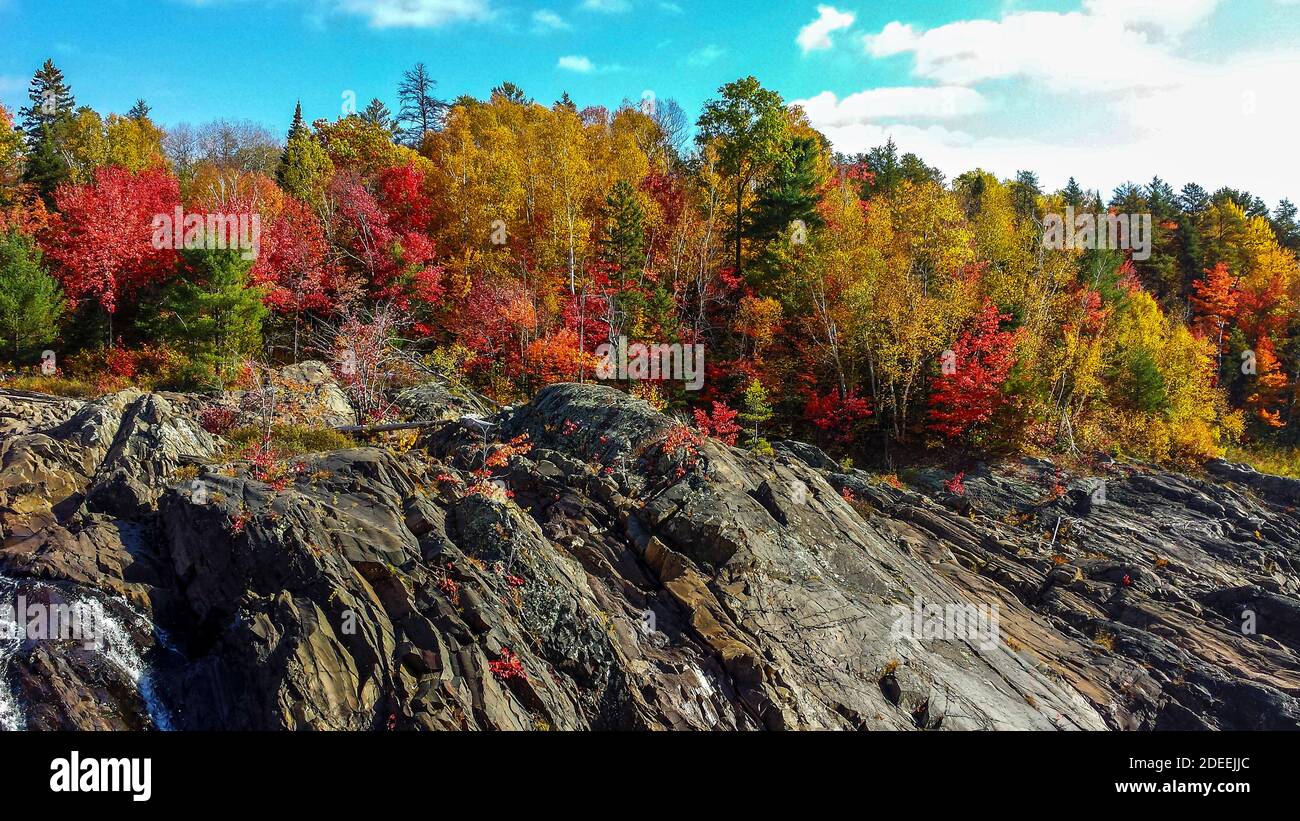 Large brown boulders define the fall foliage, Chutes Prov Park, ON ...