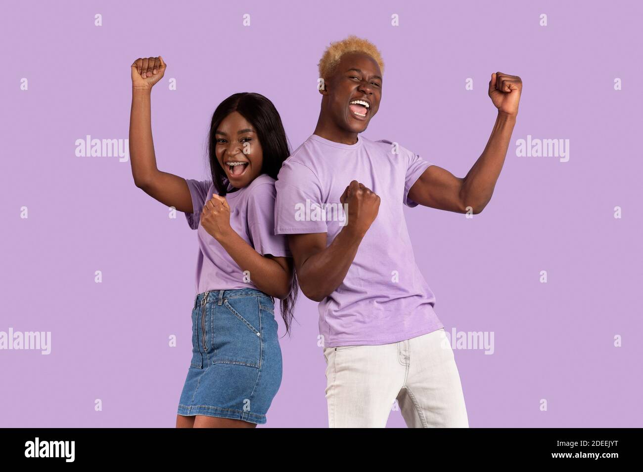 Portrait of ecstatic black couple celebrating success, gesturing YES ...