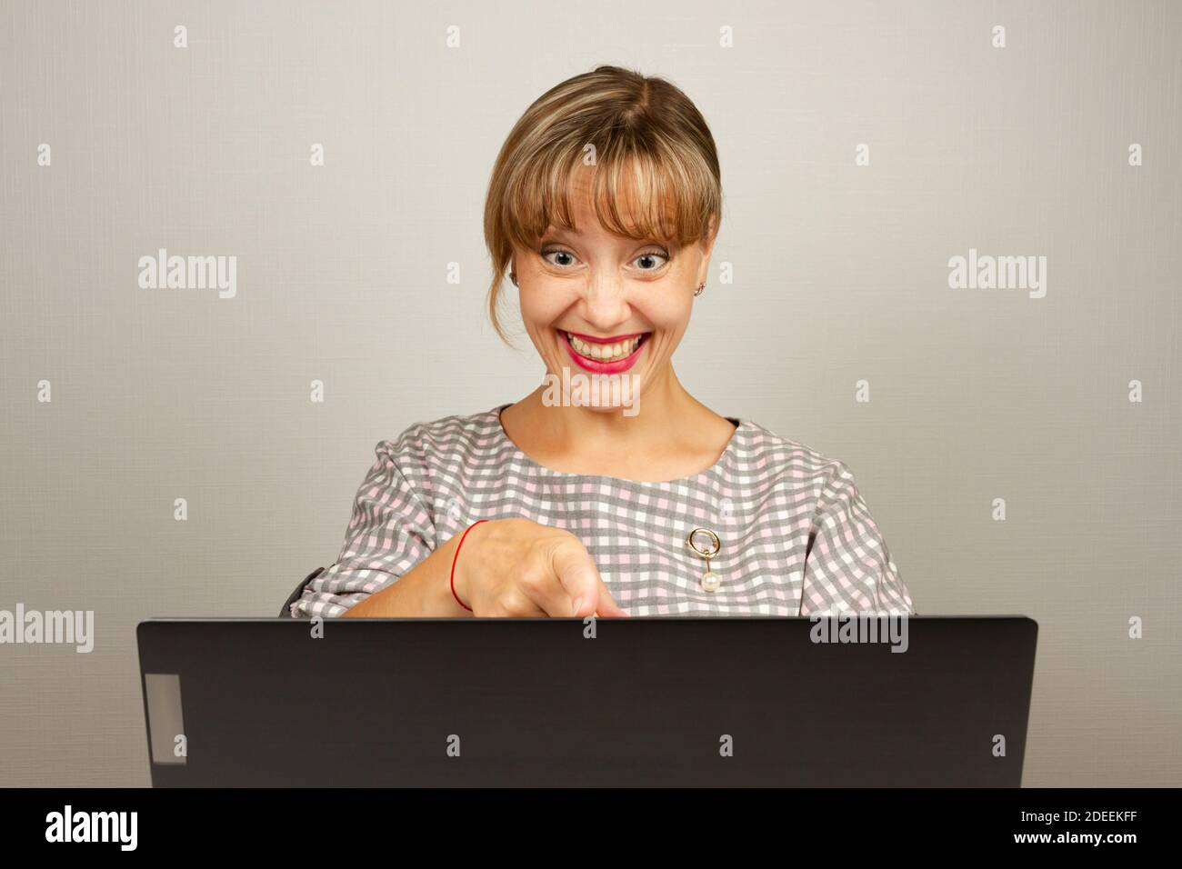 beautiful young girl was very surprised working in the office at the ...