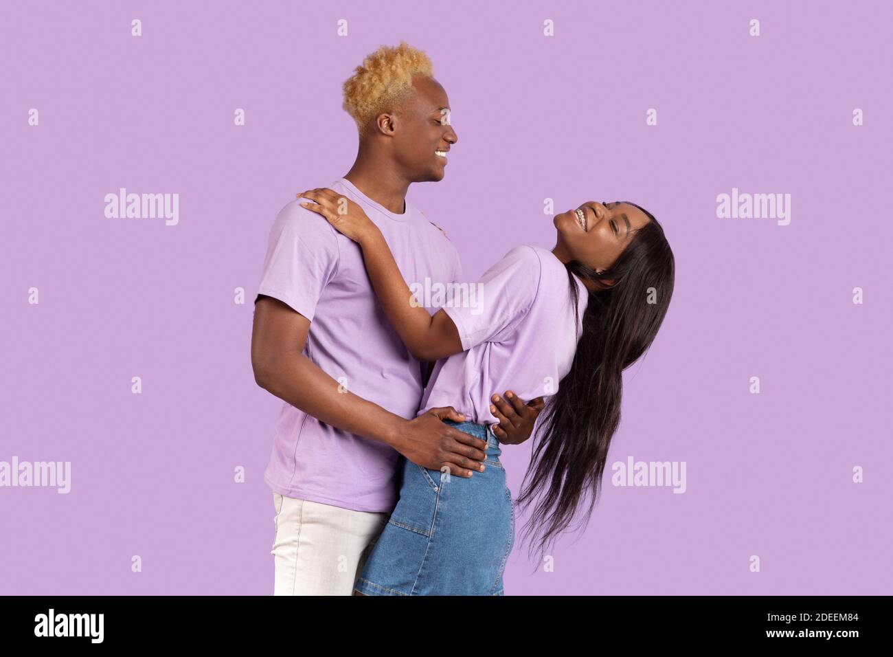 Beautiful young woman and her boyfriend dancing and having fun on ...