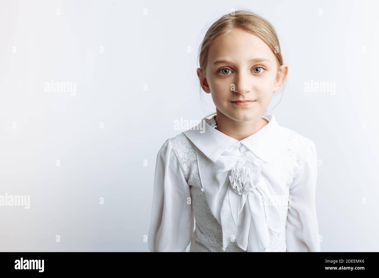 beautiful little girl, schoolgirl, white background advertisement Stock ...