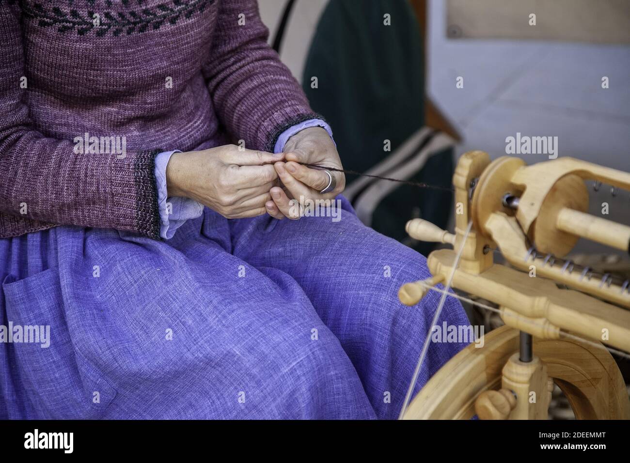 Spinner working in sewing with wool, artisan production, industry Stock ...