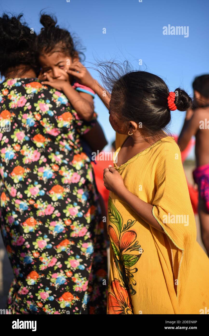 Wayuu indigenous mother holding daughter, La Guajira, Colombia Stock ...