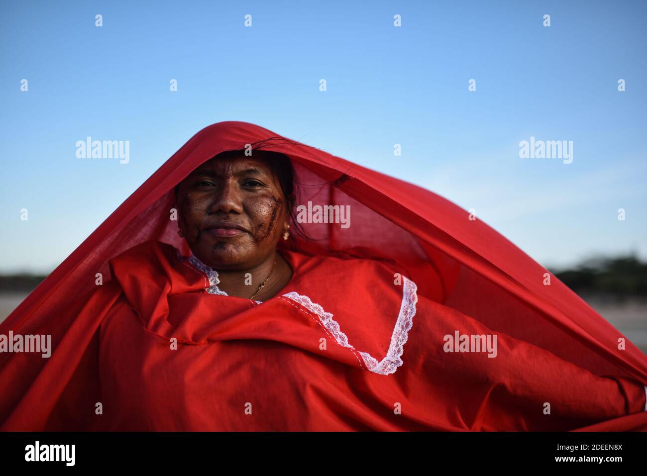 Wayuu indigenous woman wearing traditional red costume, La Guajira ...