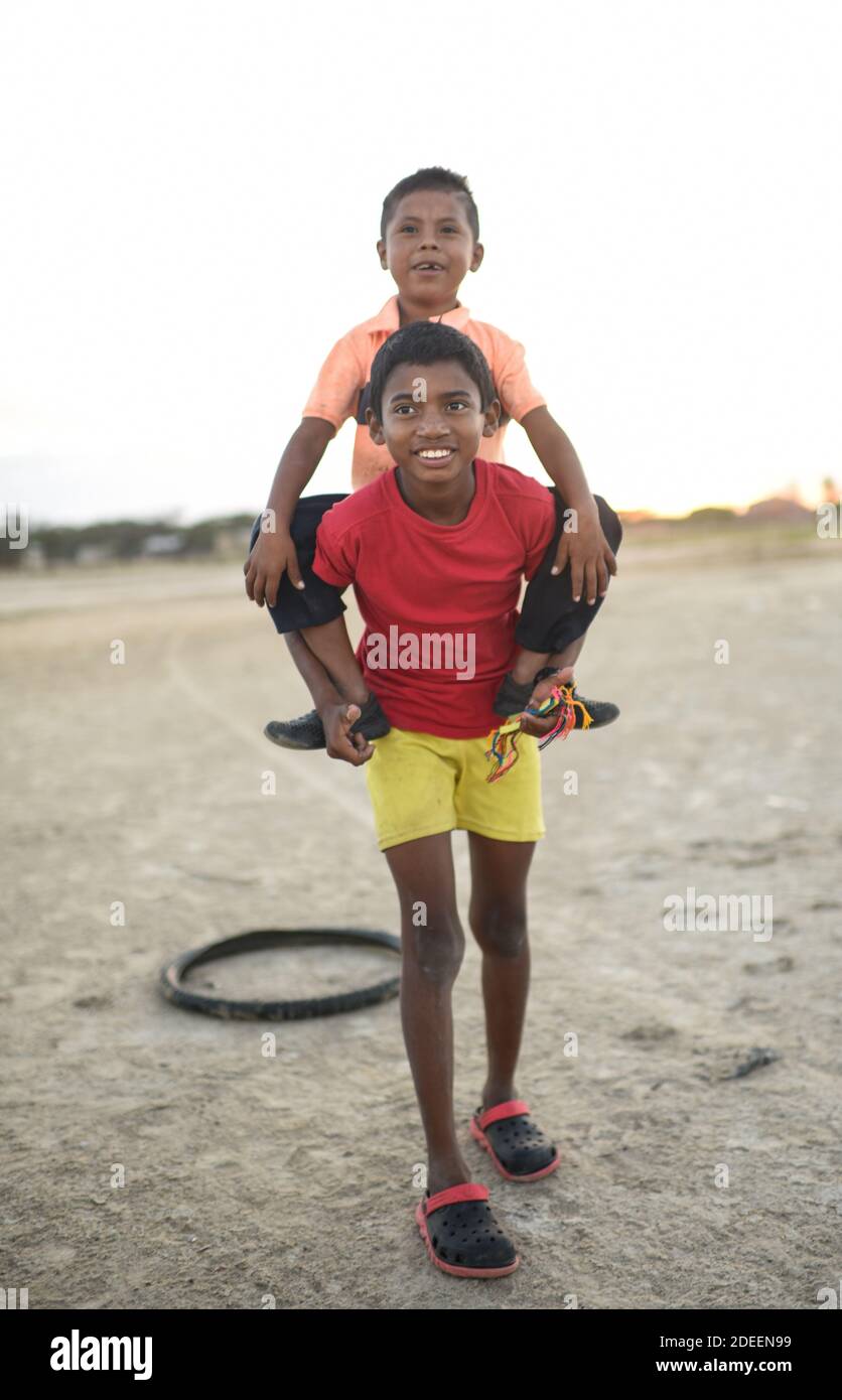 Wayuu indigenous kids playing in La Guajira, Colombia Stock Photo - Alamy
