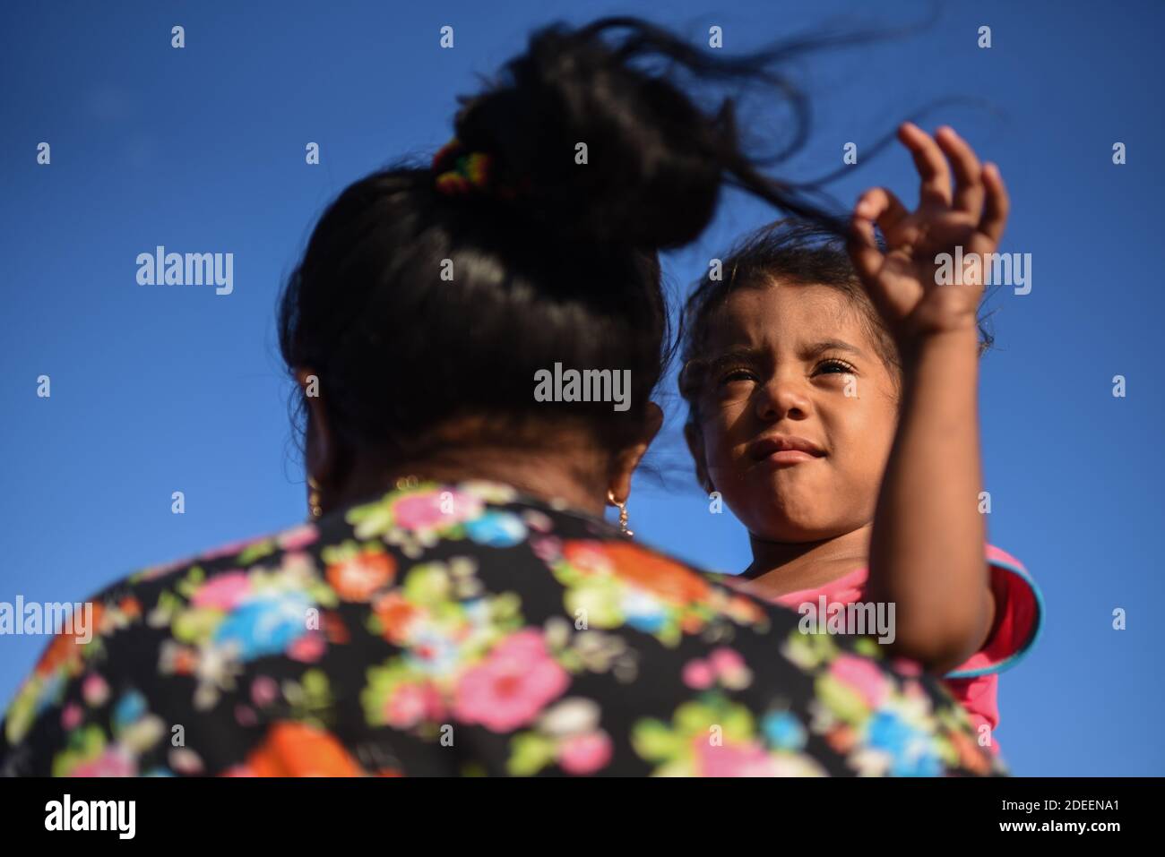 Wayuu indigenous mother holding daughter, La Guajira, Colombia Stock ...