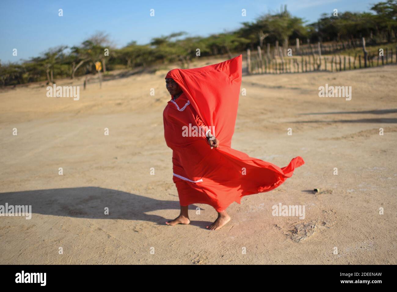 Wayuu indigenous woman wearing traditional red costume, La Guajira ...