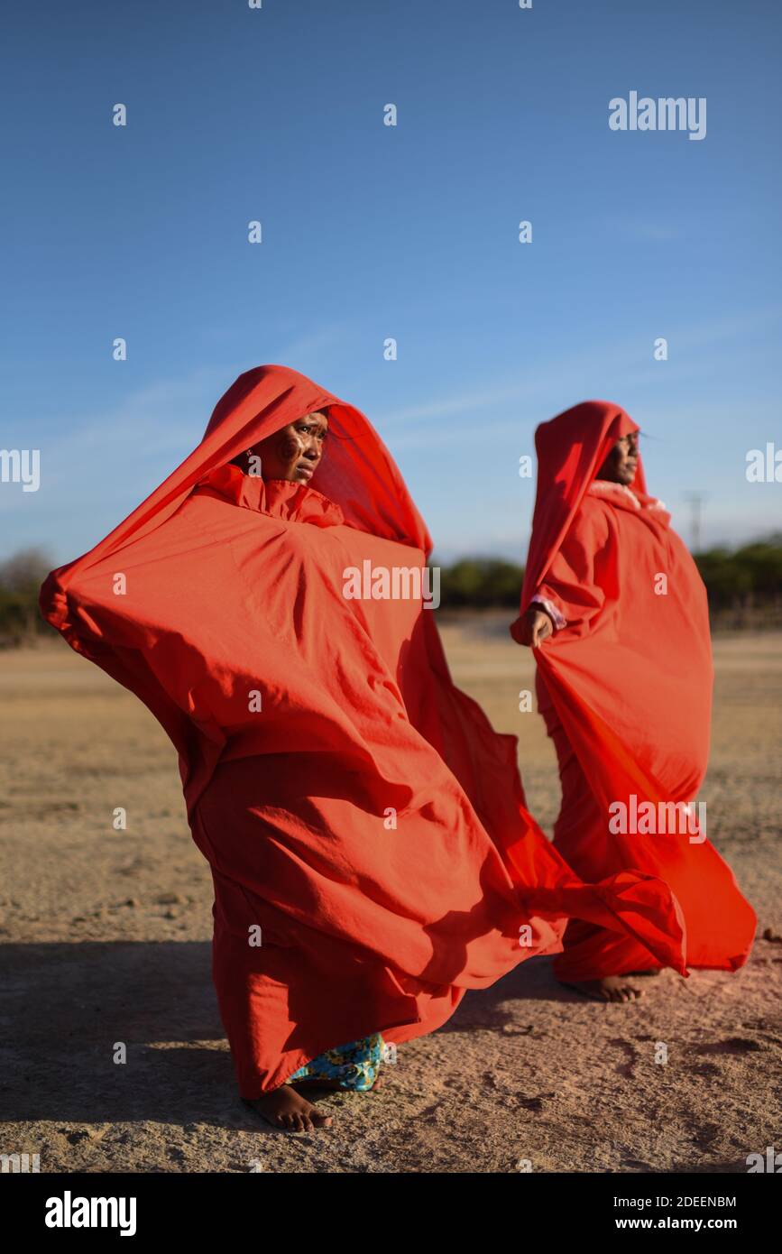 Wayuu indigenous women wearing traditional red costume, La Guajira ...