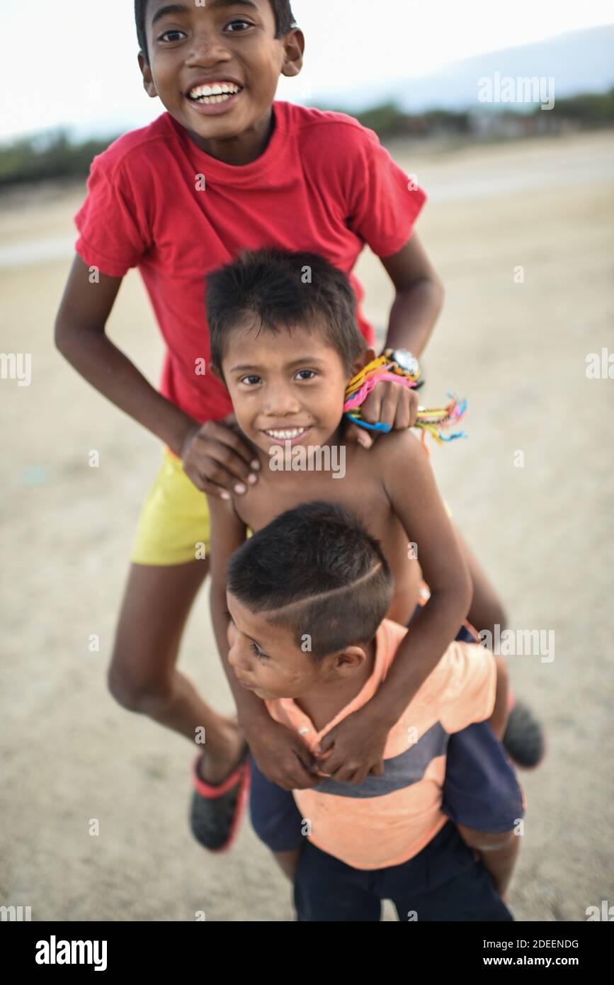 Wayuu indigenous kids playing in La Guajira, Colombia Stock Photo - Alamy
