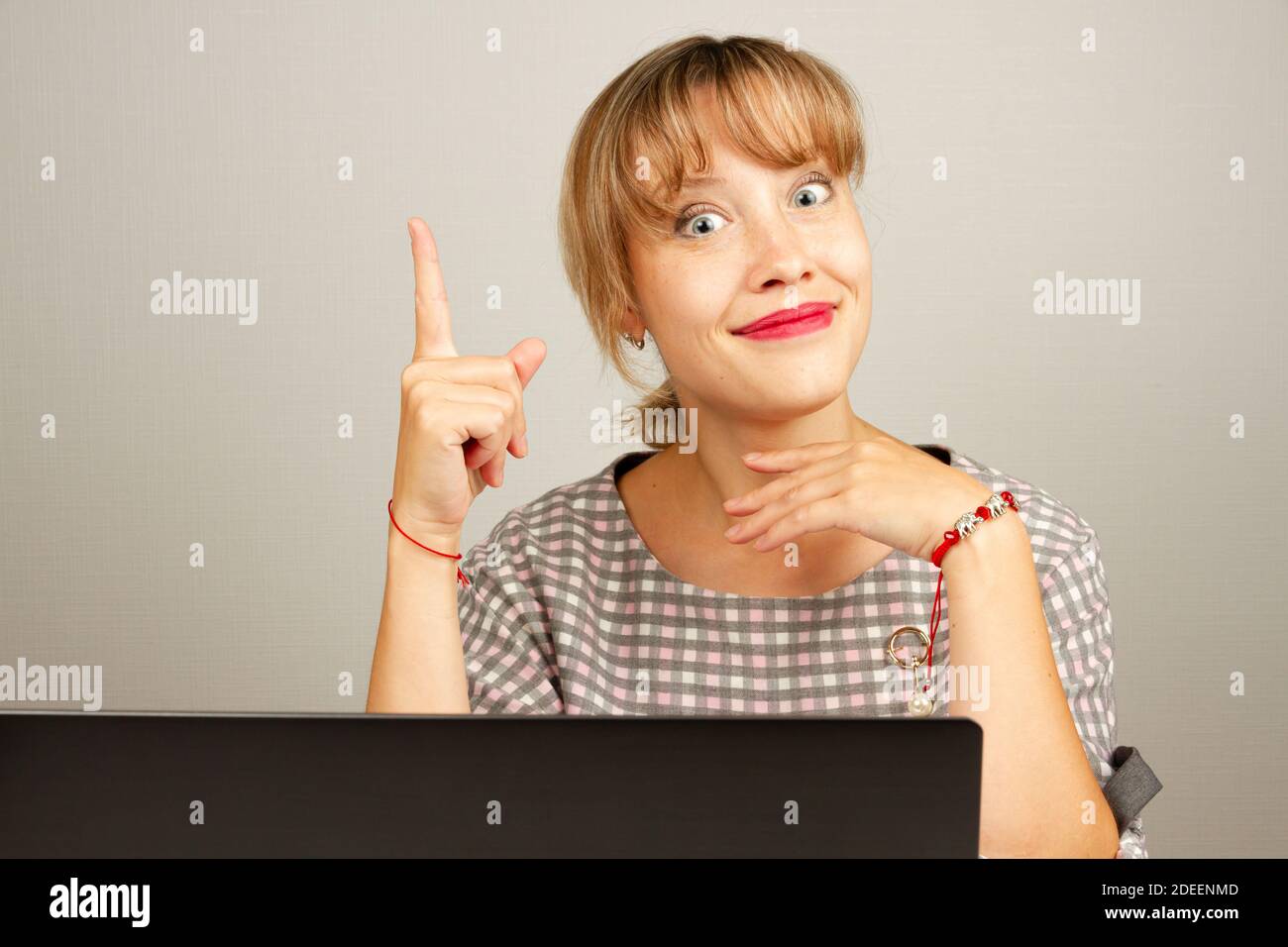beautiful young girl thinking in the office at the computer Stock Photo ...