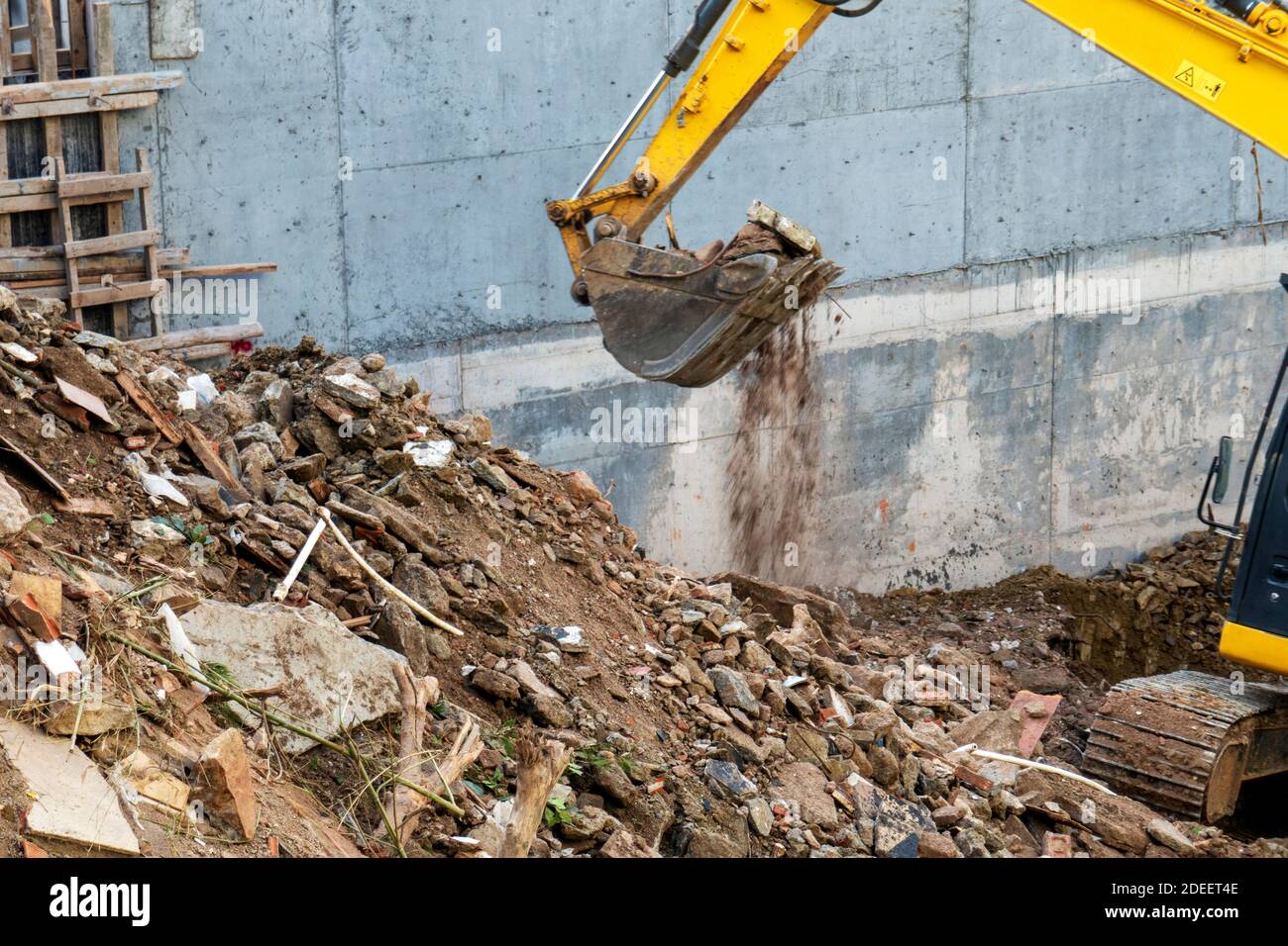 Urban transformation.Heavy equipment being used to tear tearing down ...