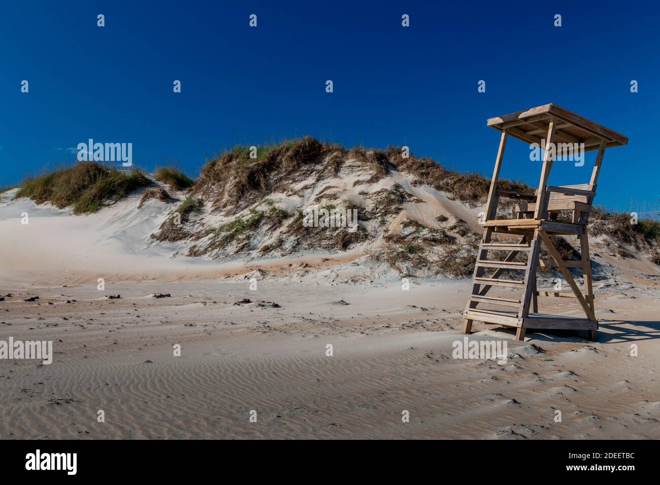 Unmanned lifeguard station beside the dunes and empty beaches due to ...