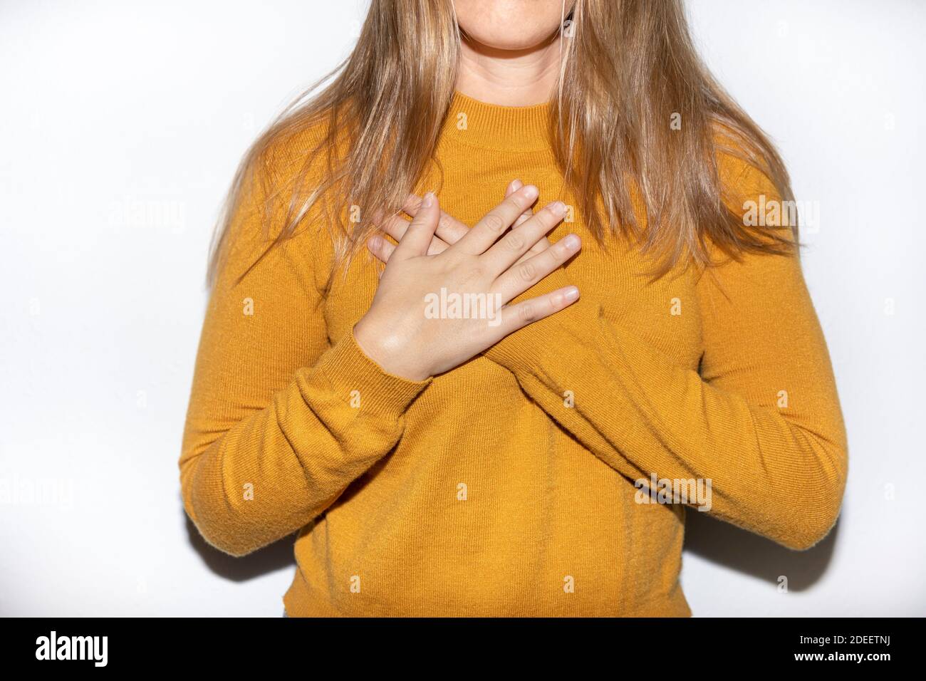 Female crossing her hands on chest isolated on white background.Concept ...