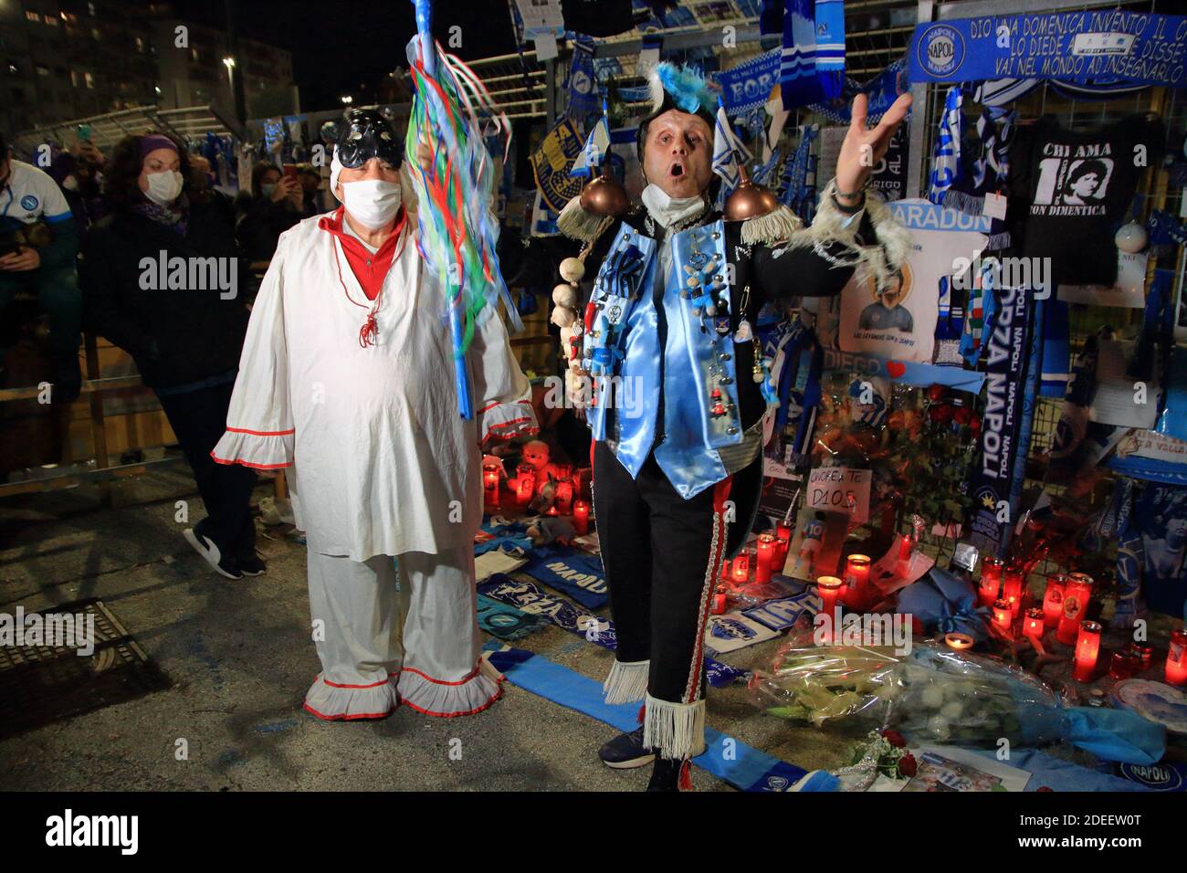 Two fans dressed in traditional Neapolitan costumes in front of the ...