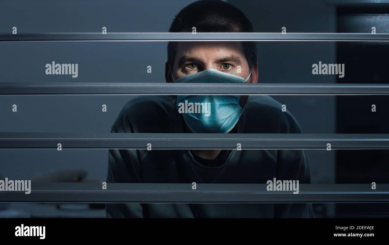 Man in Quarantine Looking out the Window. Staying Home at Lockdown ...