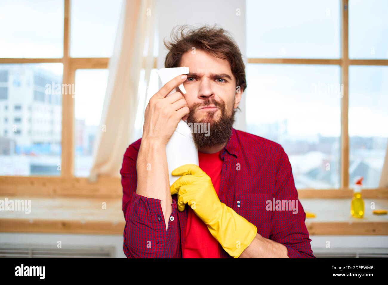 Cheerful man cleaning detergent homework hygiene interior Stock Photo ...