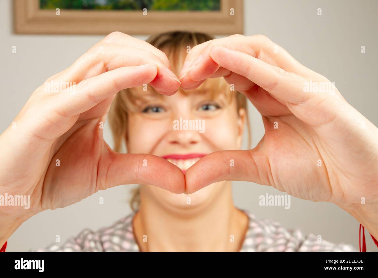 beautiful girl showing signs with her hands Stock Photo - Alamy