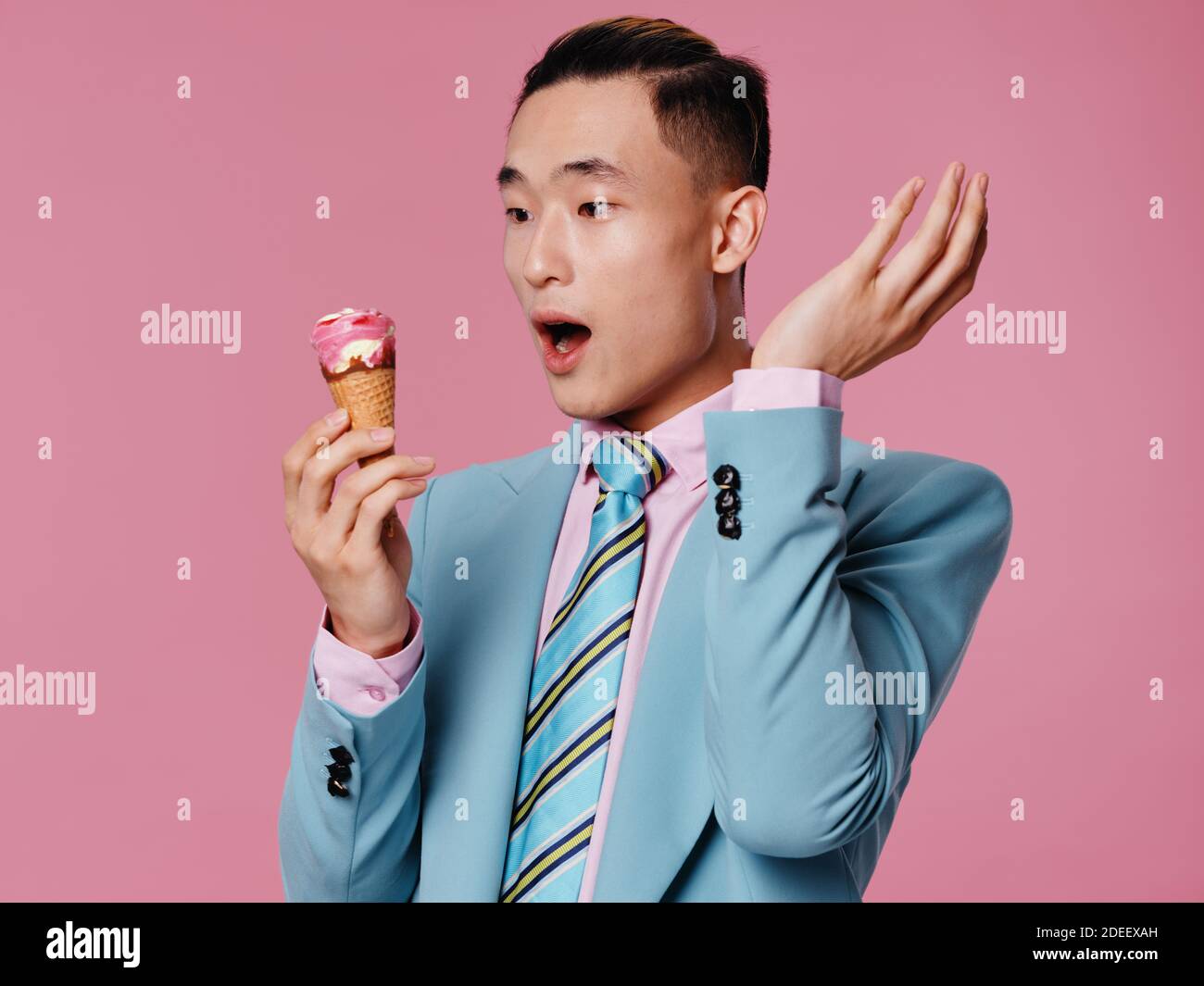 surprised man in blue suit looking at ice cream emotions cropped view ...