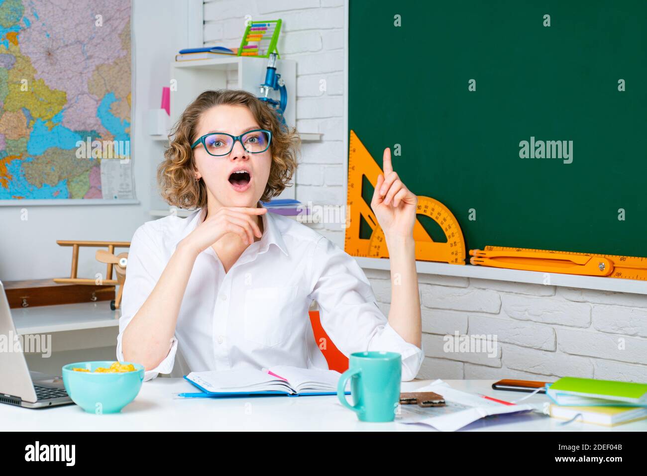 Excited teacher have idea at classroom in school Stock Photo - Alamy