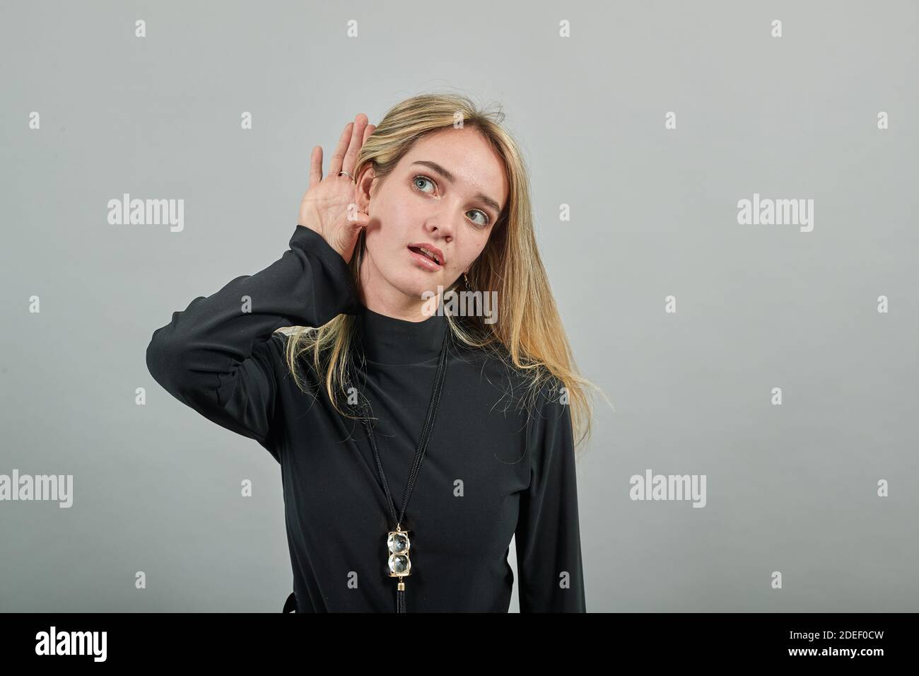 Business woman hand ear listening hi-res stock photography and images ...