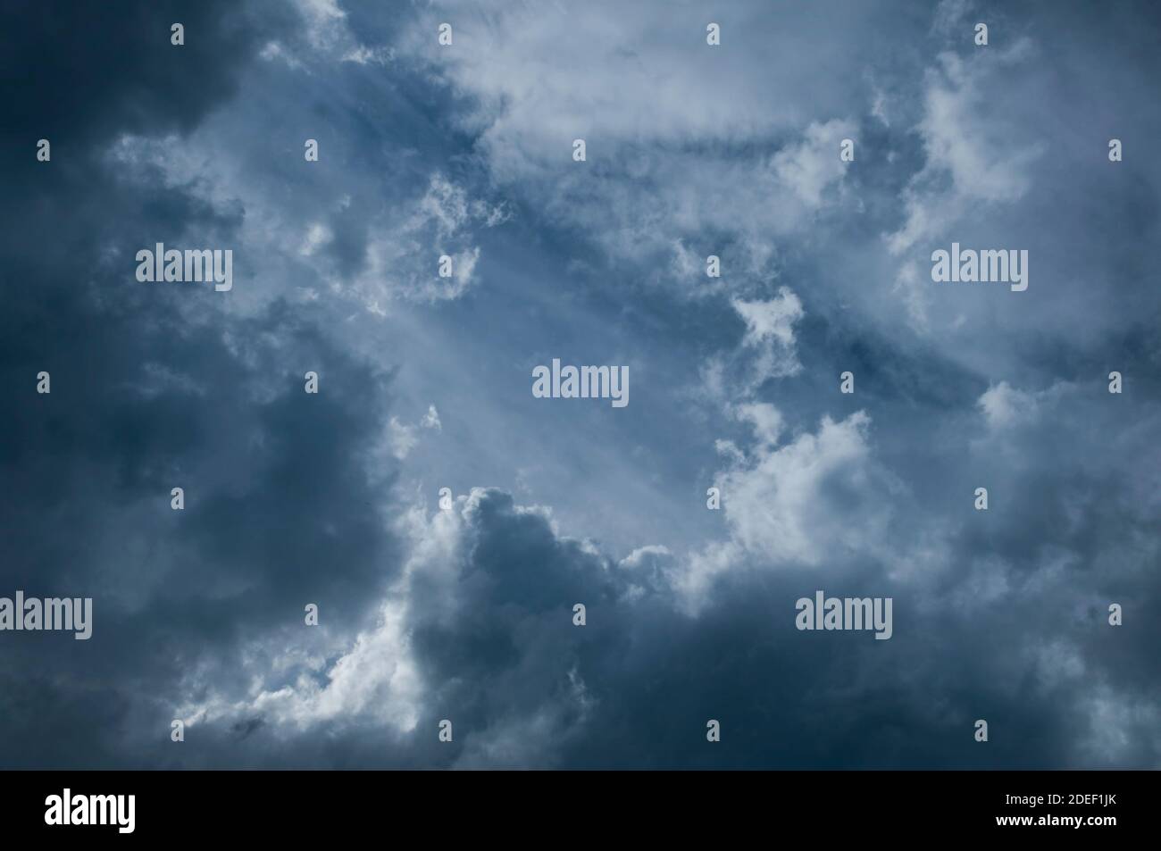 Dramatic dark blue sky with heavy clouds background Stock Photo - Alamy