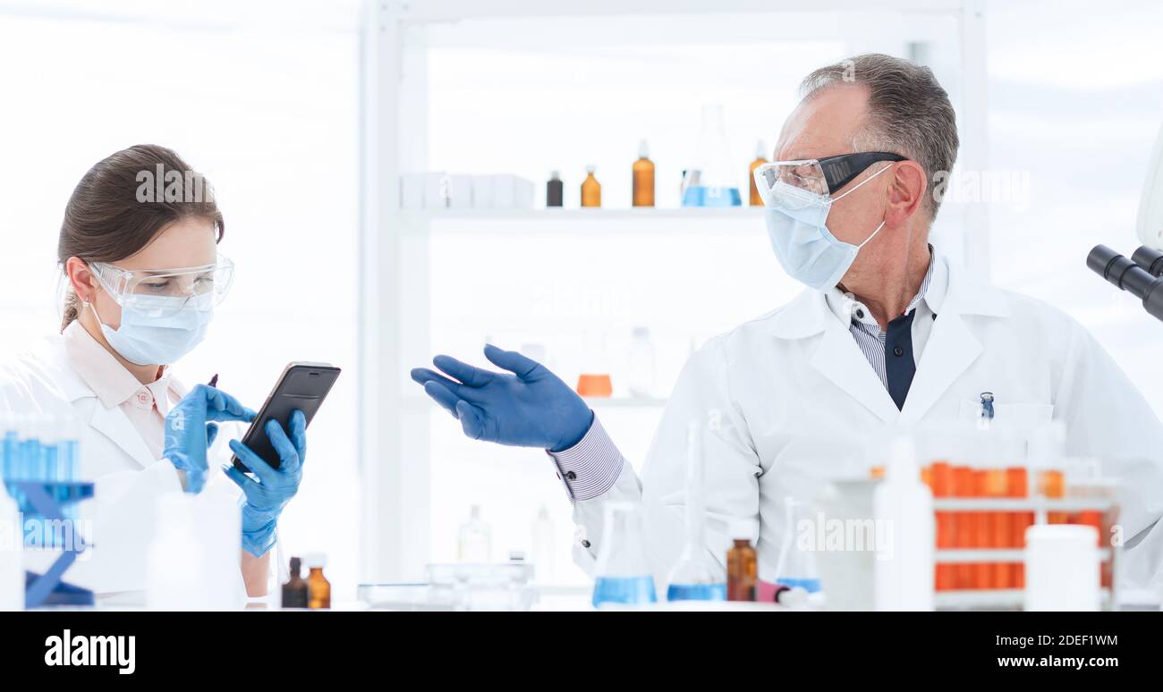 Laboratory assistant holding pipette dispenser hi-res stock photography ...