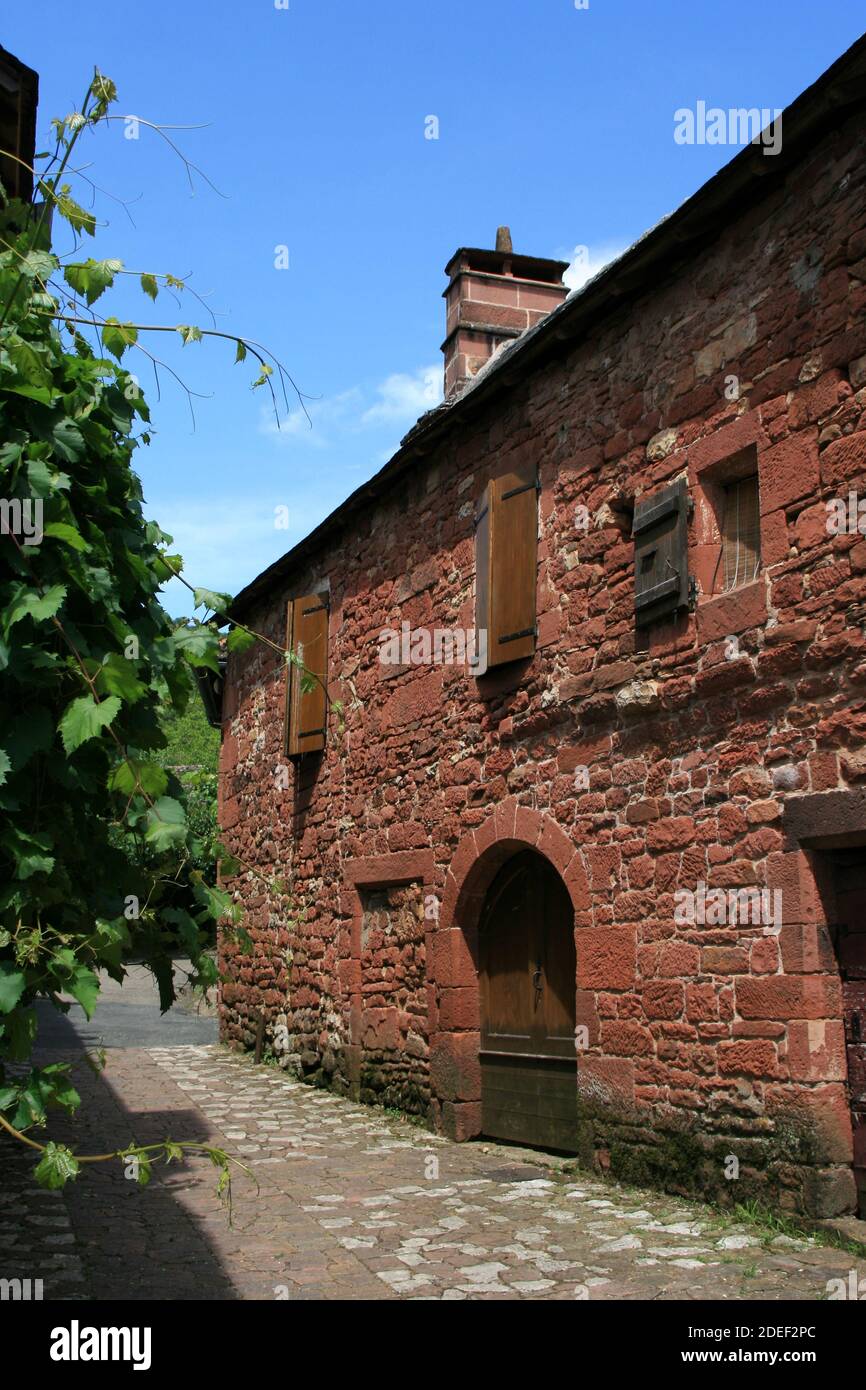 red stone houses and alley in collonges-la-rouge in france Stock Photo ...