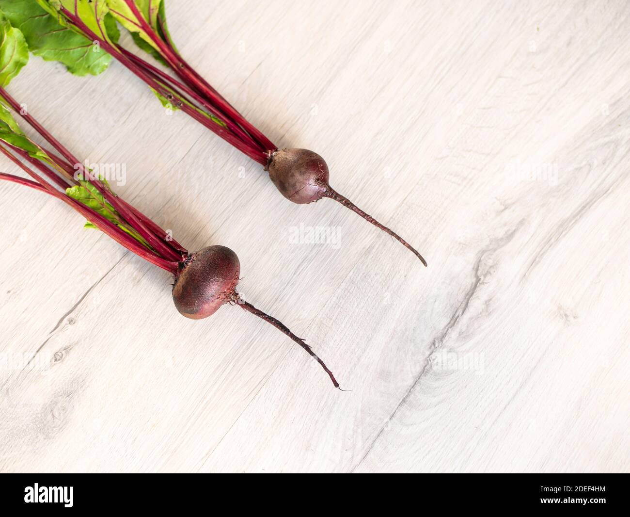Fresh beautiful washed beets on a light background Stock Photo - Alamy