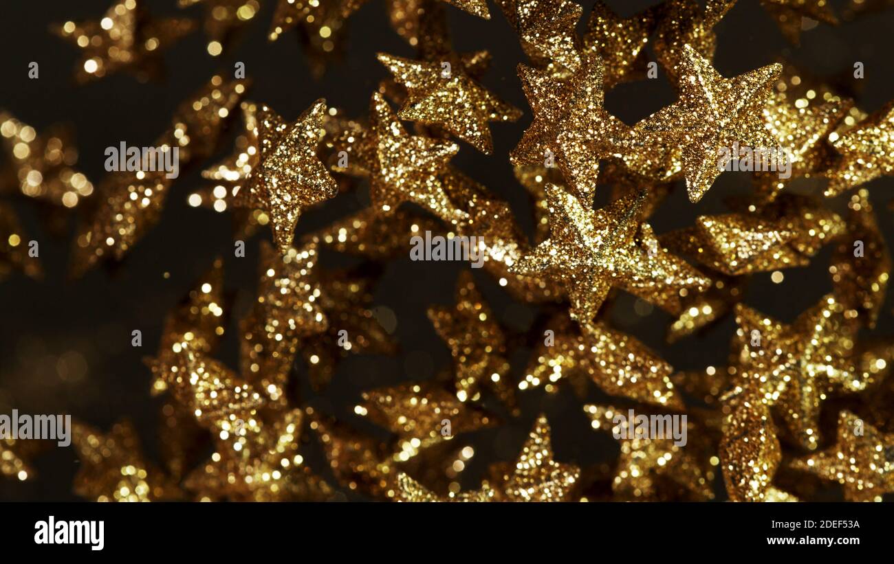 Gold stars flying up in the air, abstract background Stock Photo - Alamy