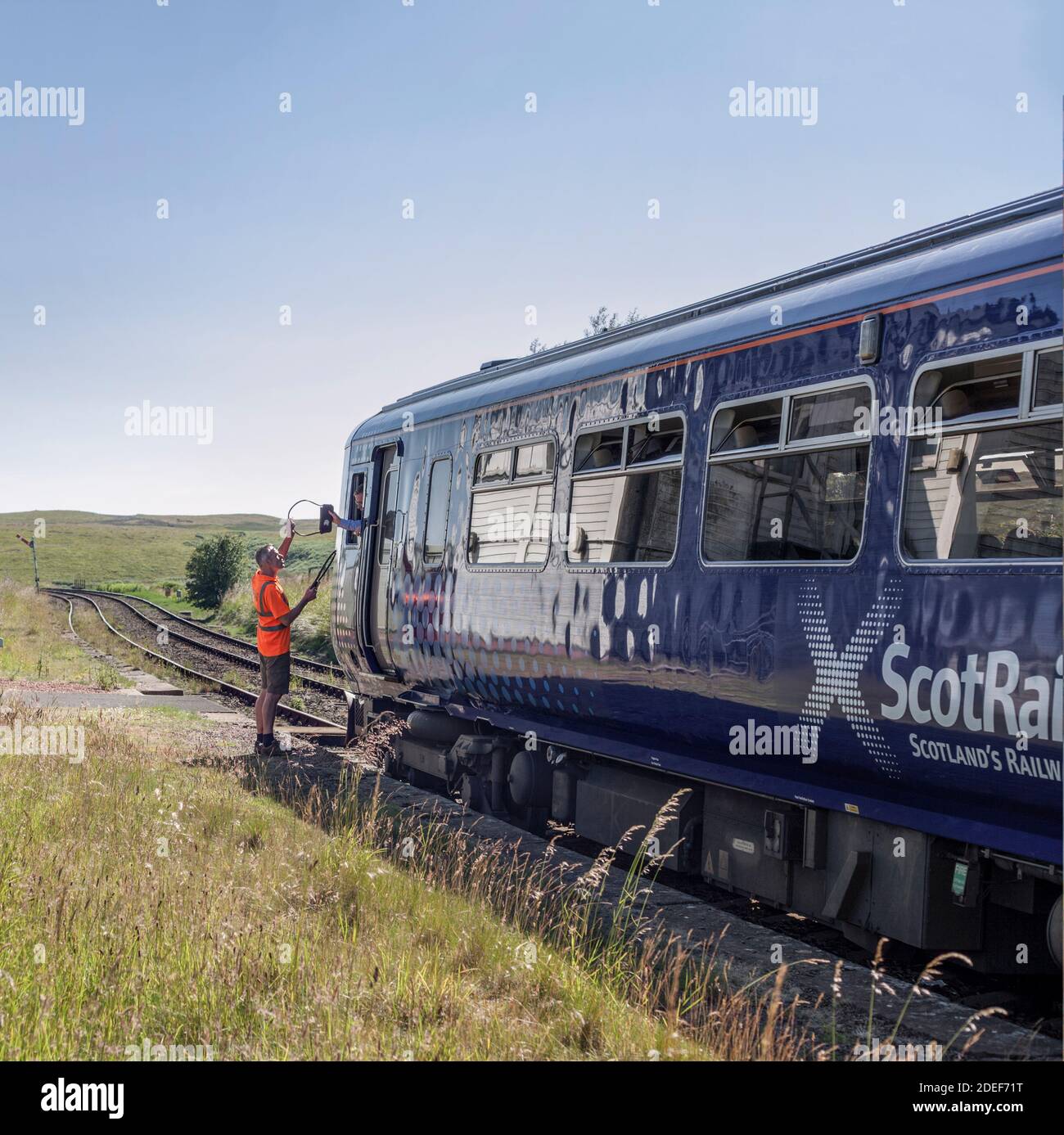 Glenwhilly Network Rail signaller exchanging single line tokens with ...