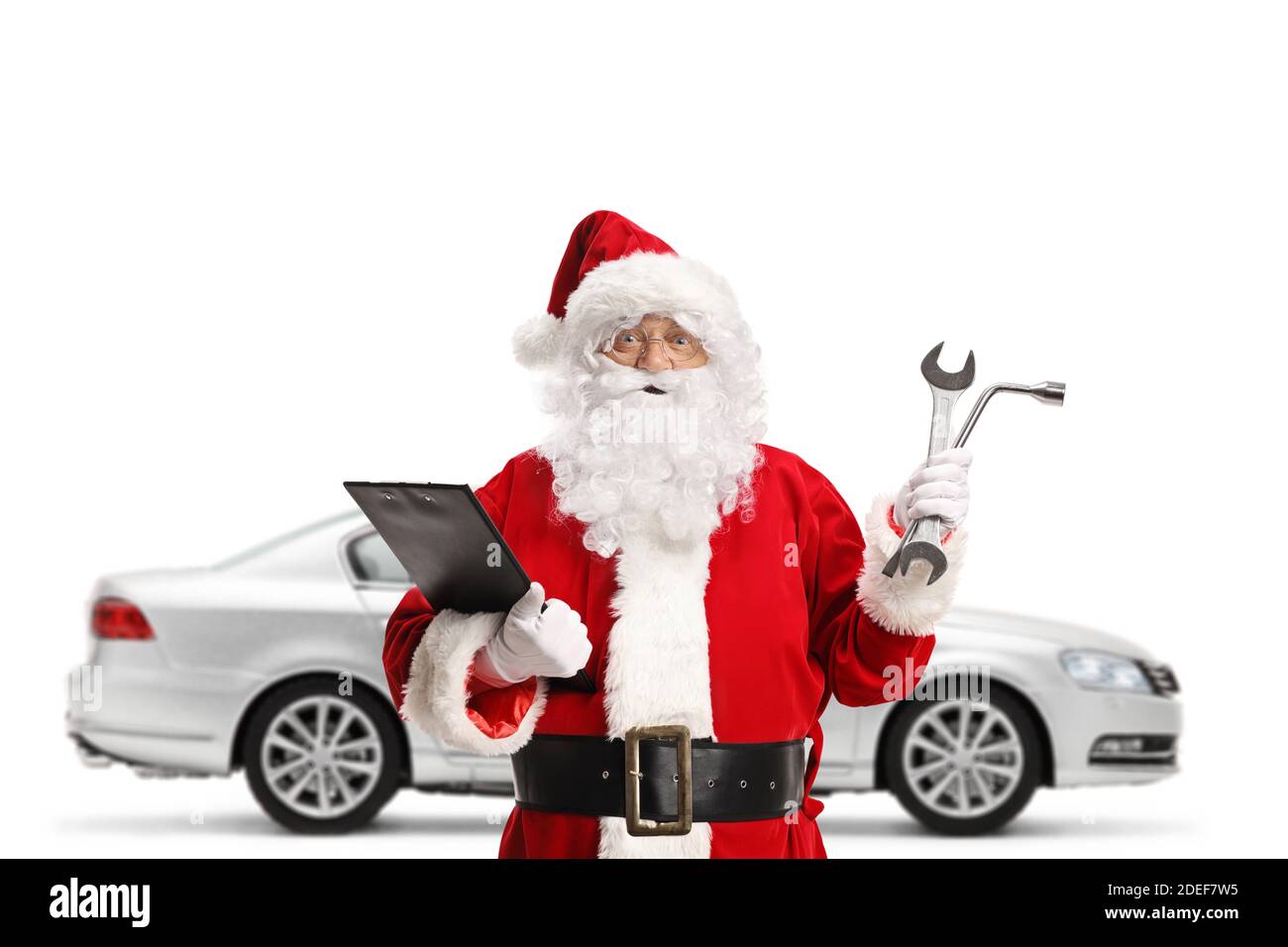 Santa claus with a silver car holding car repair tools isolated on ...