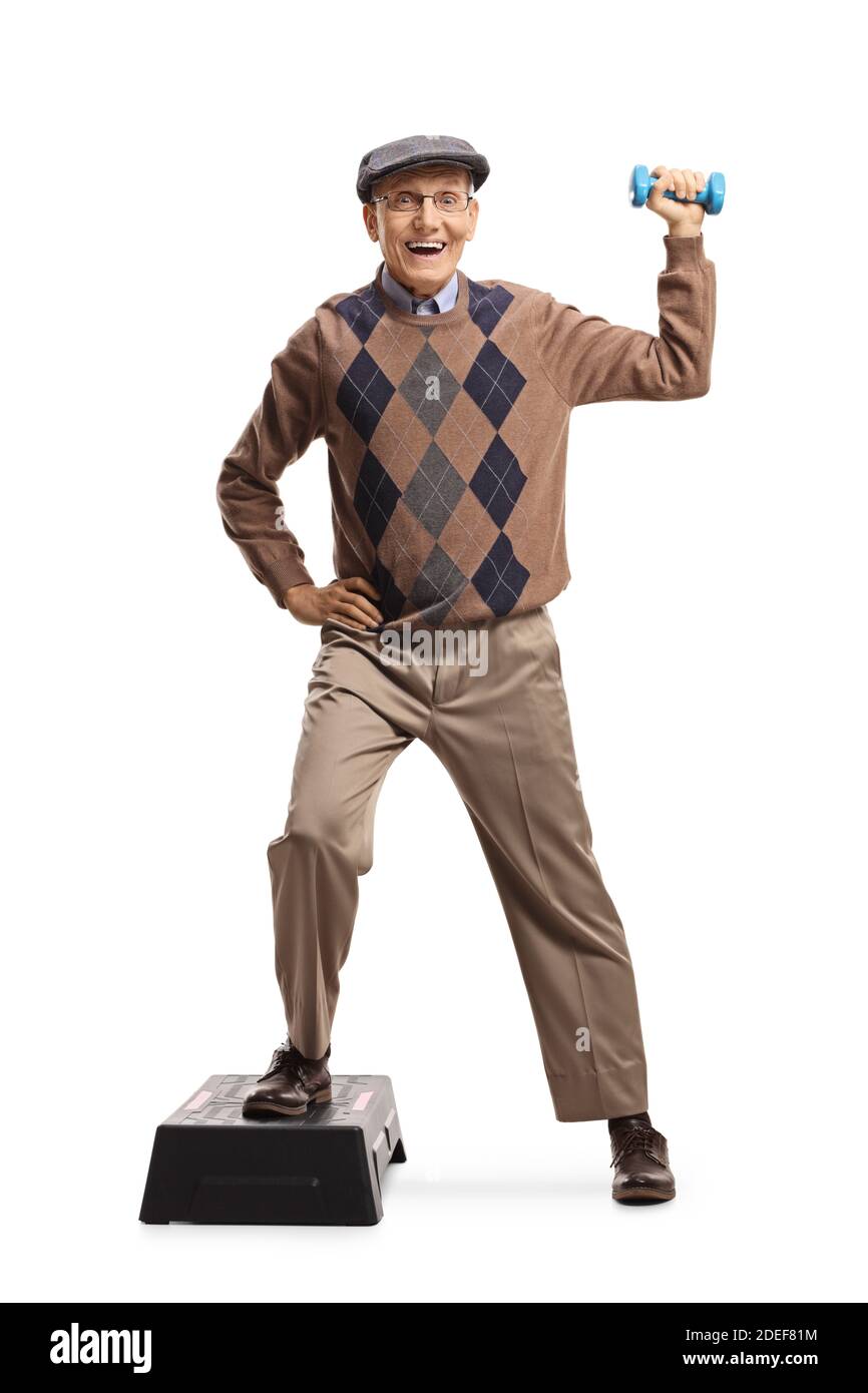 Full length portrait of an elderly man exercising on a step aerobic ...
