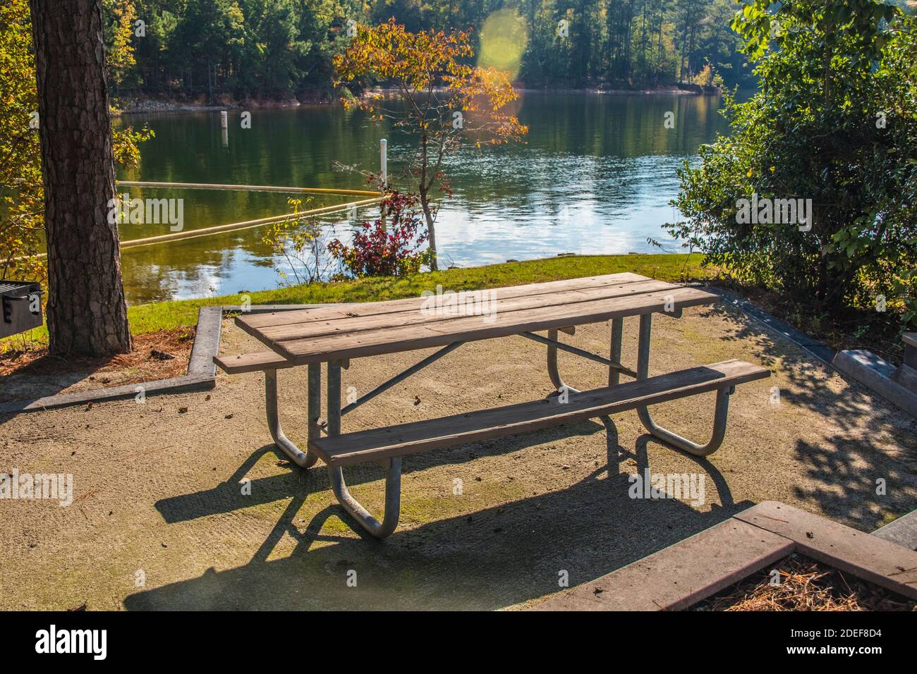 A picnic table at a park at the lake Stock Photo - Alamy