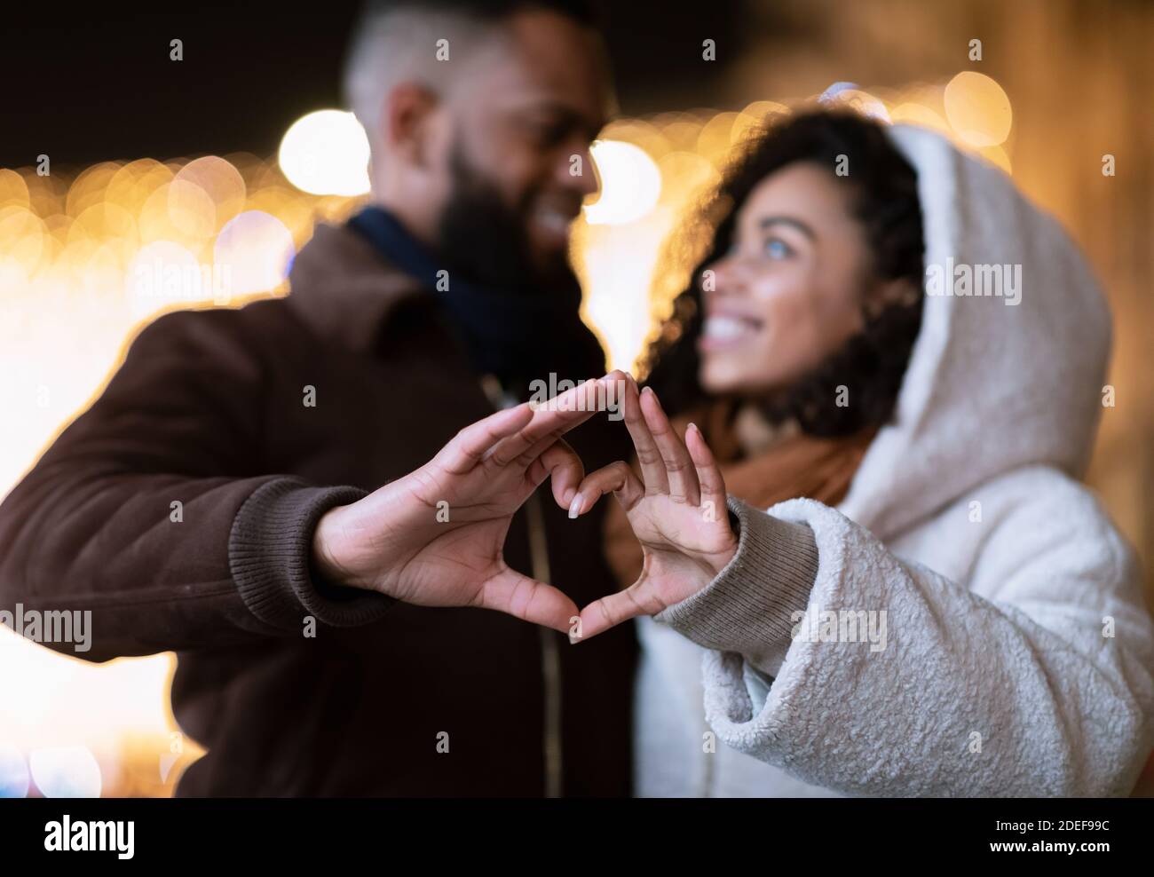 Portrait of african american couple making heart shape with hands Stock ...