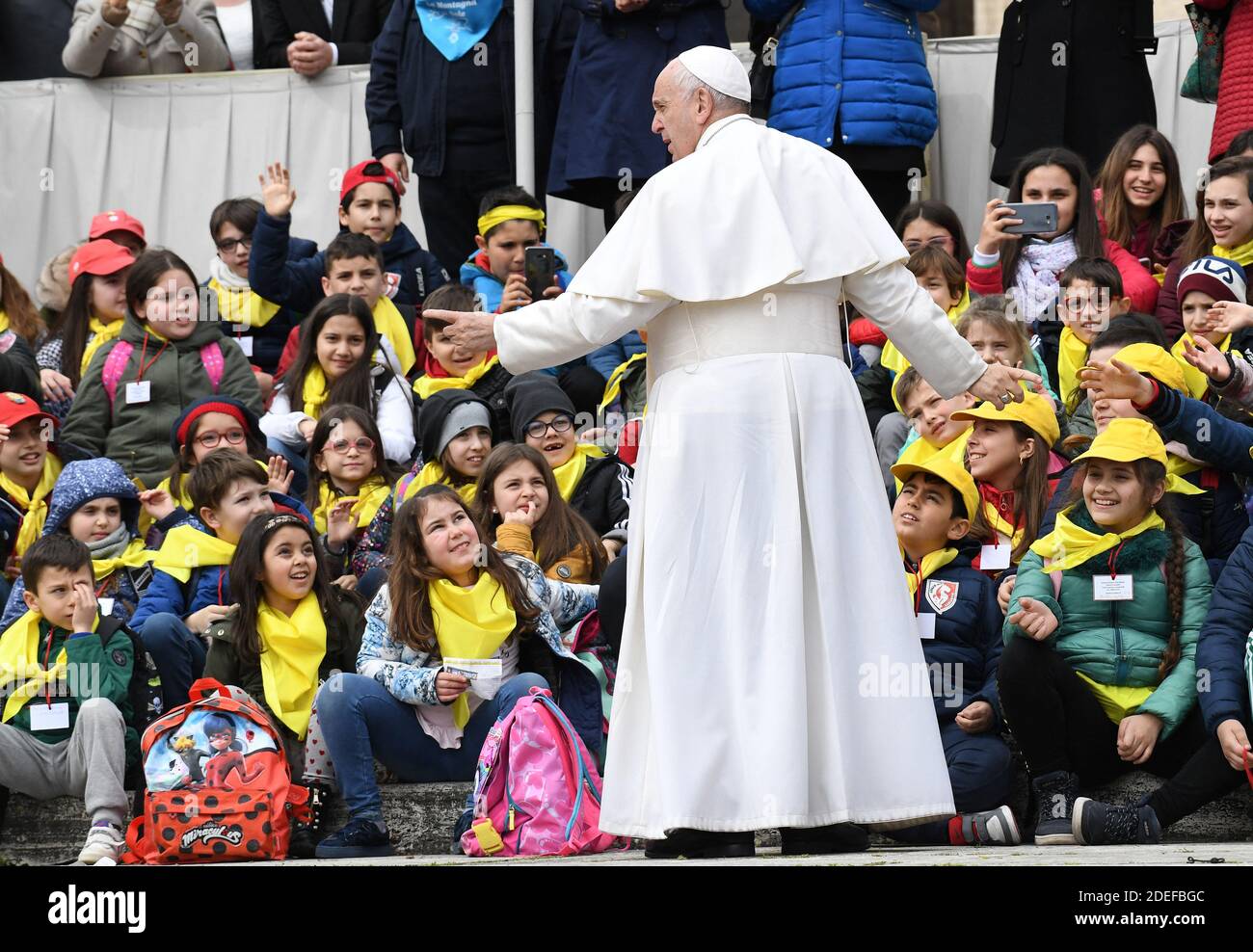 Pope Francis waves a group of children at the end of the weekly general ...