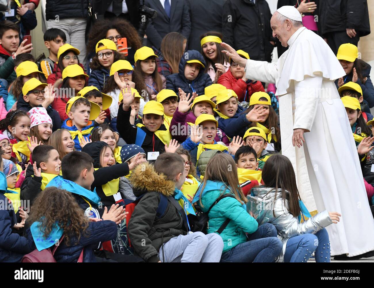 Pope Francis waves a group of children at the end of the weekly general ...