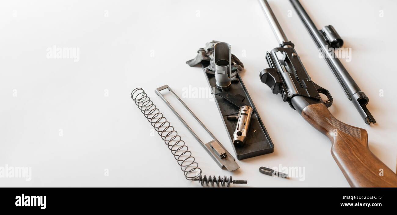 classic wooden and metal hunting weapon rifle disassembled parts and ...