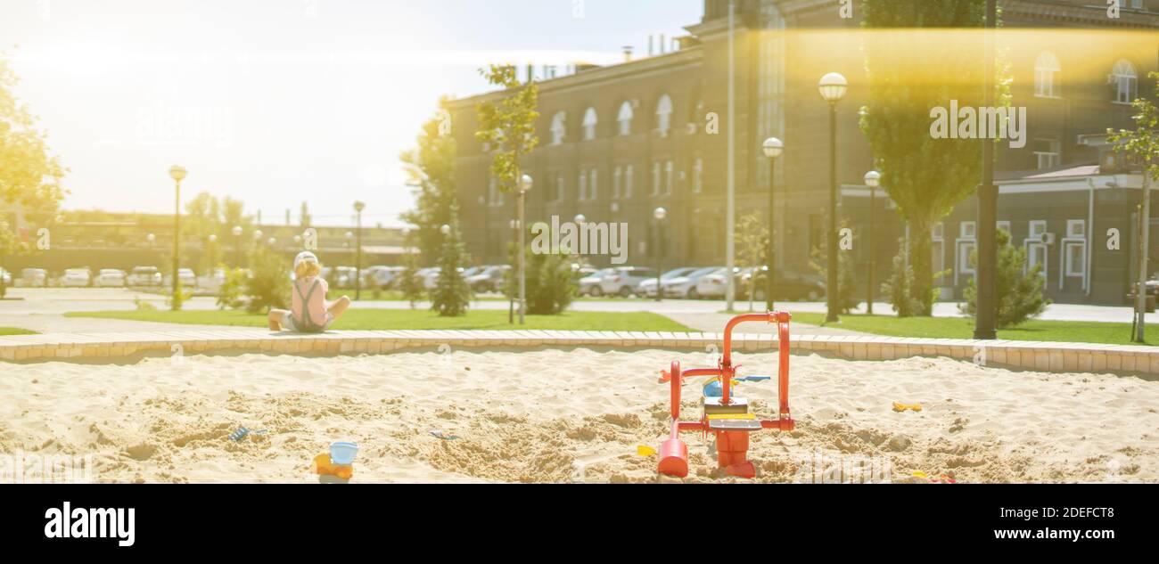 the sandbox in the public place in the street, town park with ...