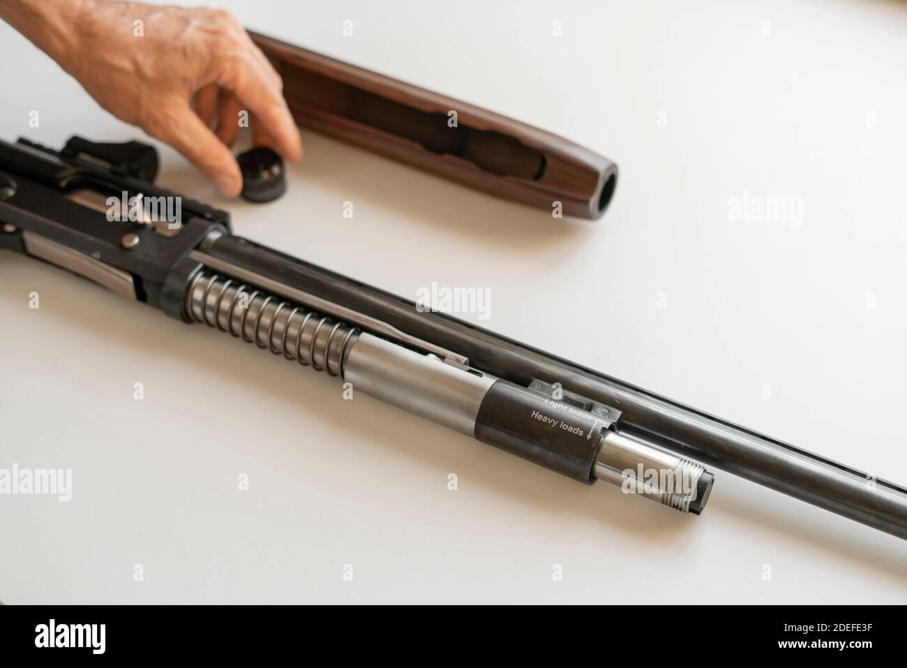 man's hands disassemble the classic shooting weapon rifle, sport ...