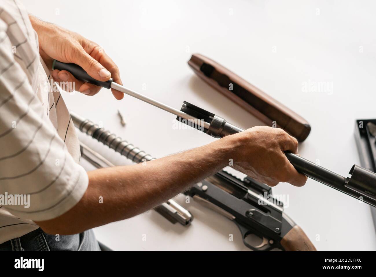 Mans hand holding gun hi-res stock photography and images - Alamy