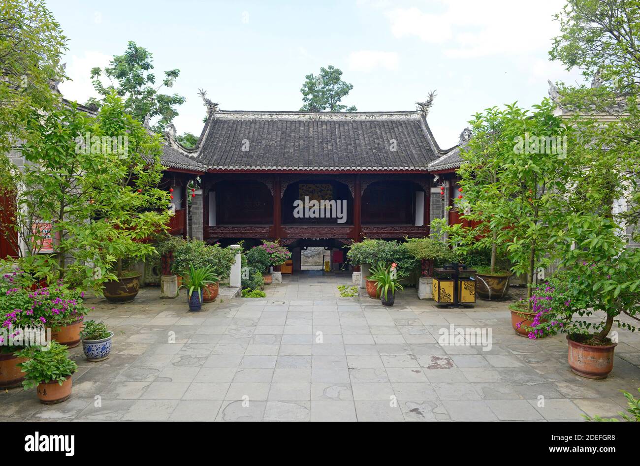Traditional and restored buildings around a courtyard in Qingyan ...