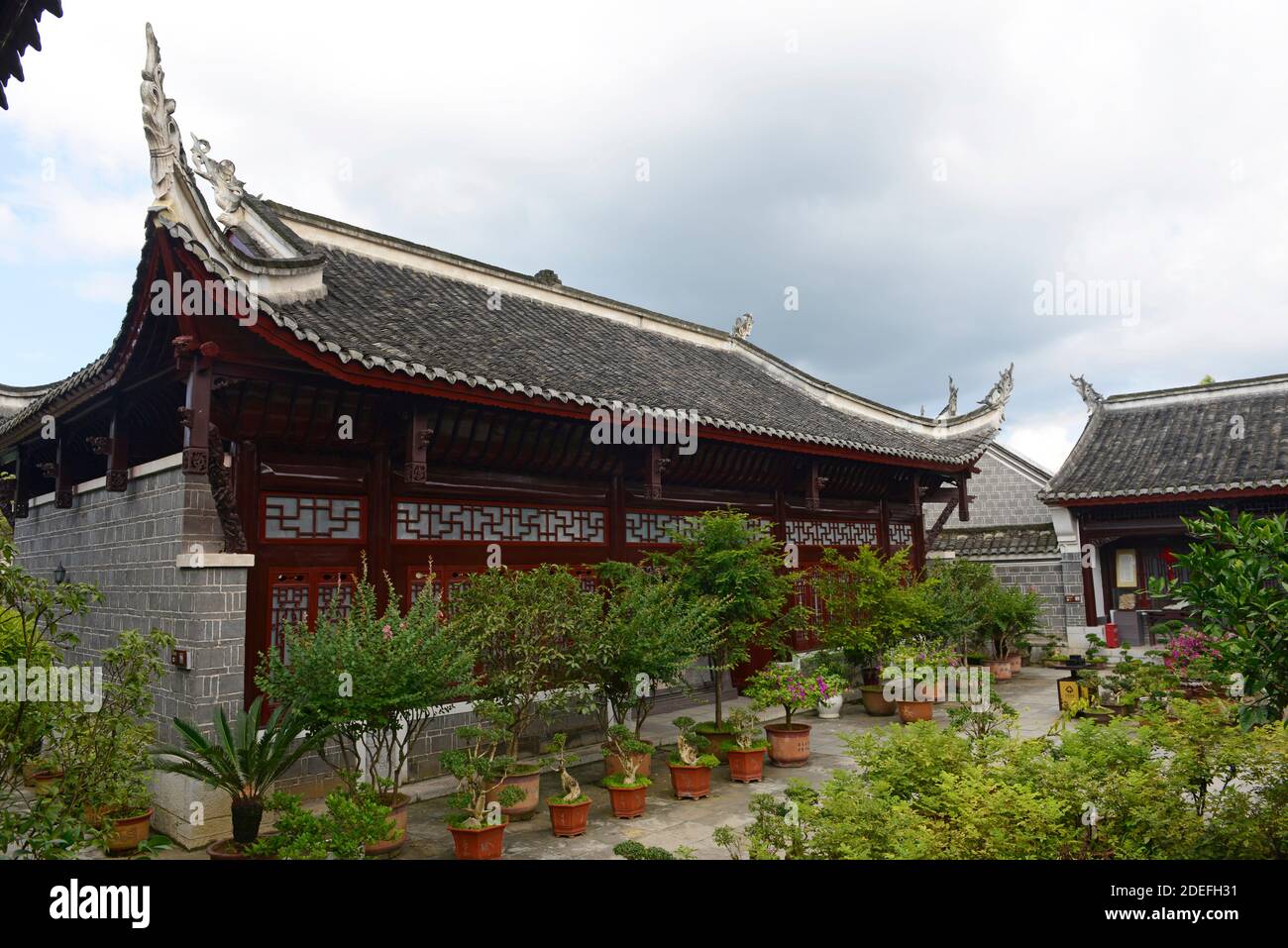 Traditional and restored buildings around a courtyard in Qingyan ...