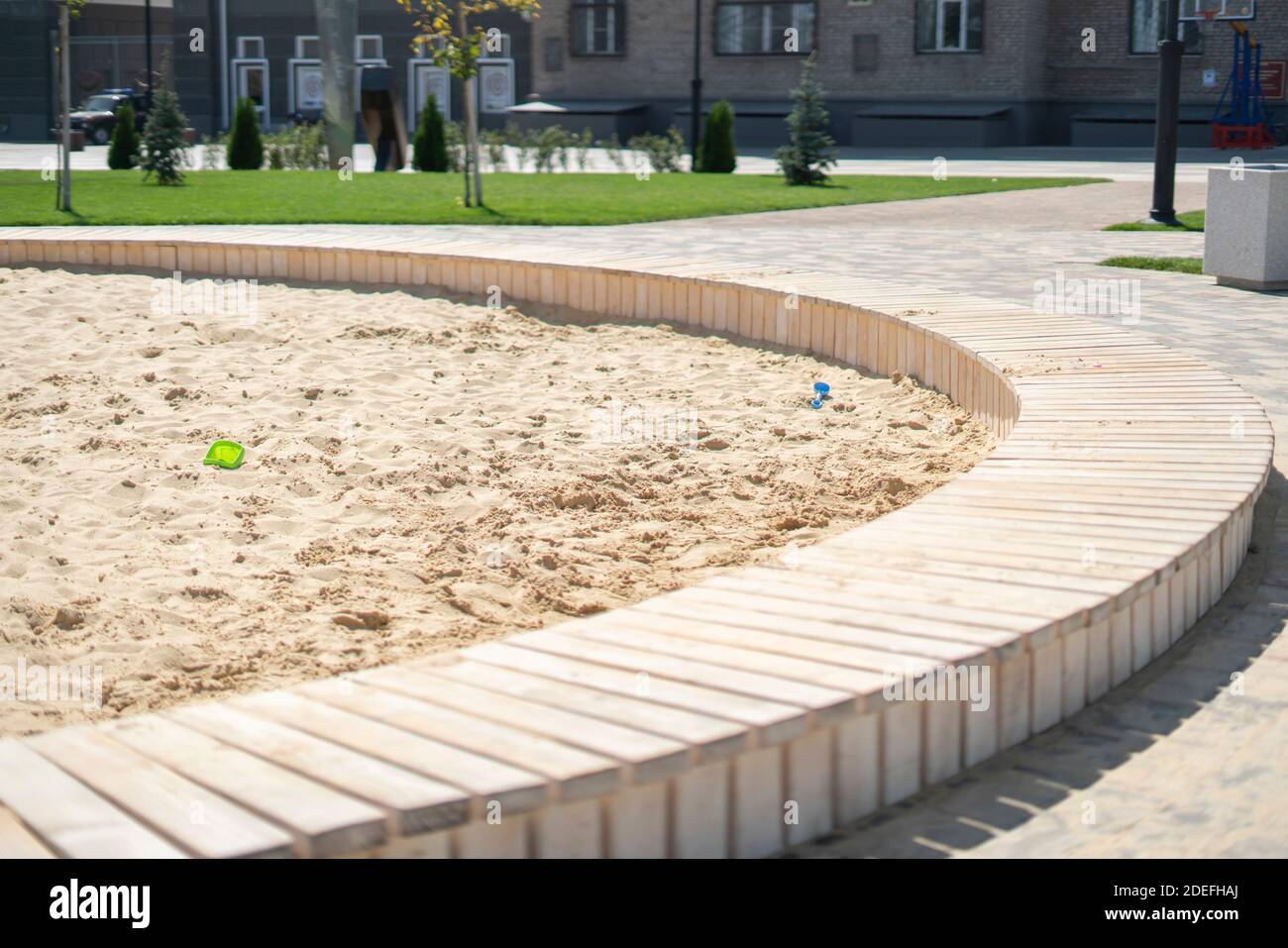 the sandbox in the public place in the street, town park with ...